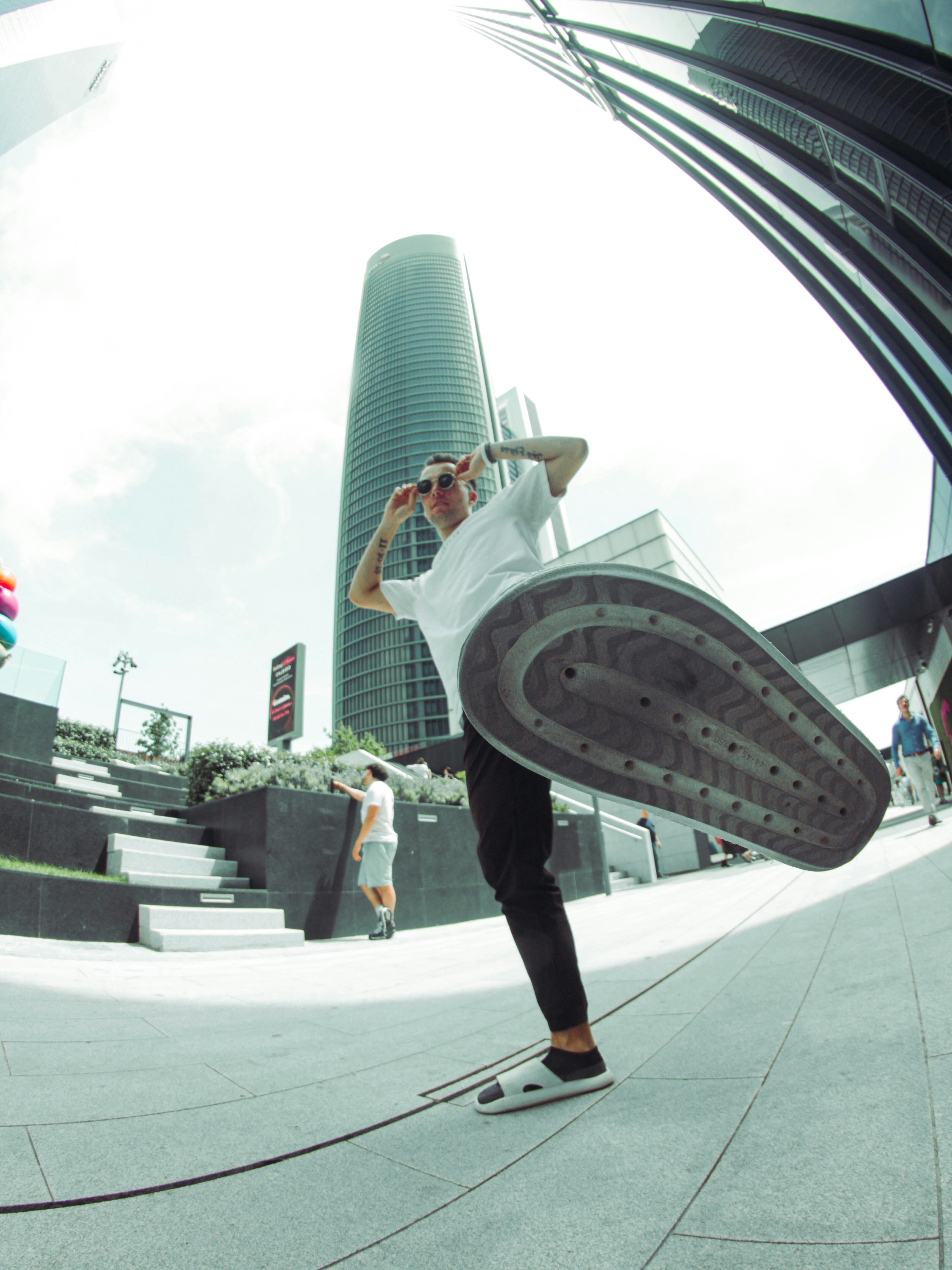 Urban Kick: A Sneakers-Forward Leap Under Skyscrapers