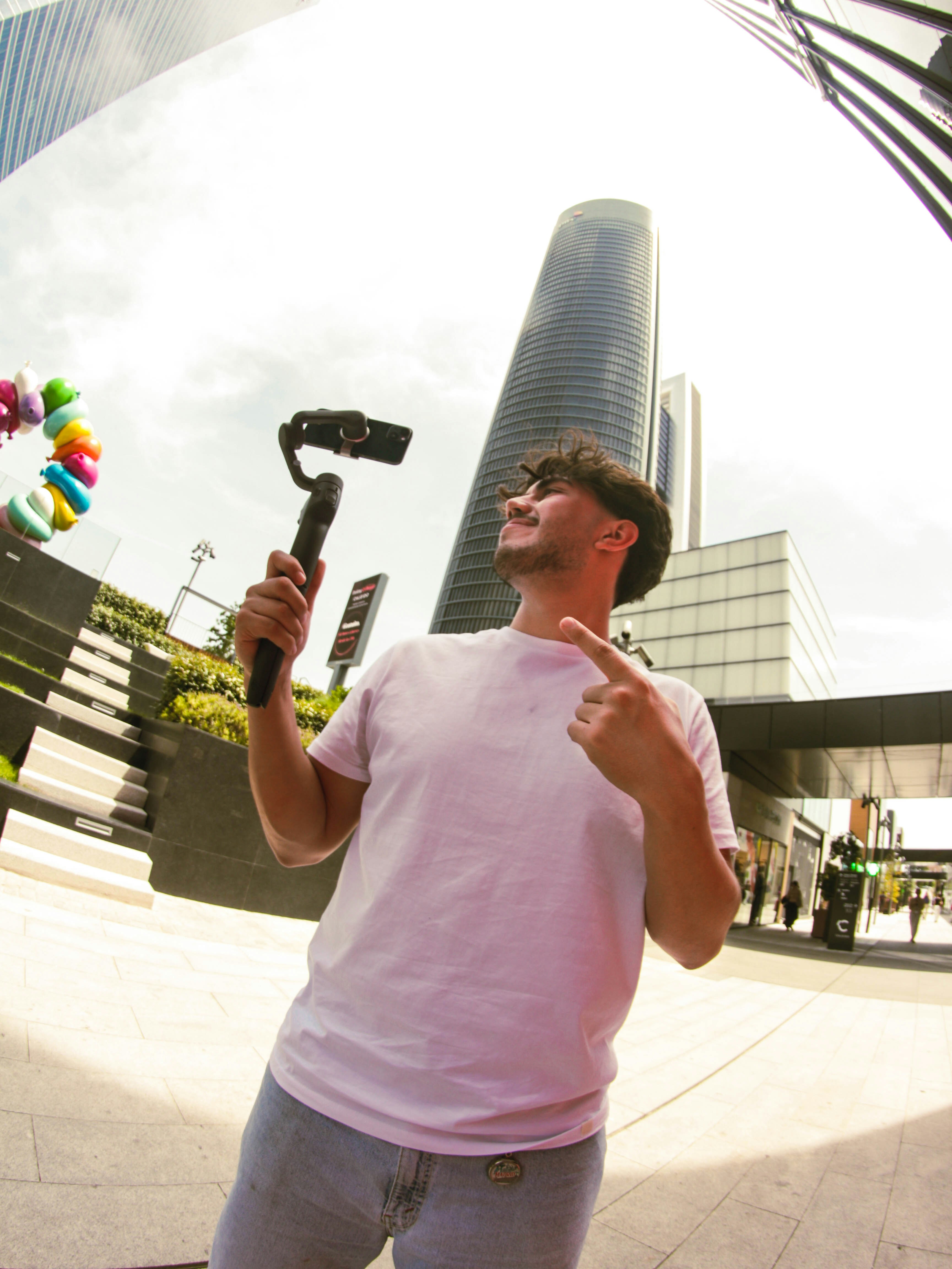 Gleaming city selfie: capturing height and spontaneity with a palm-held gimbal