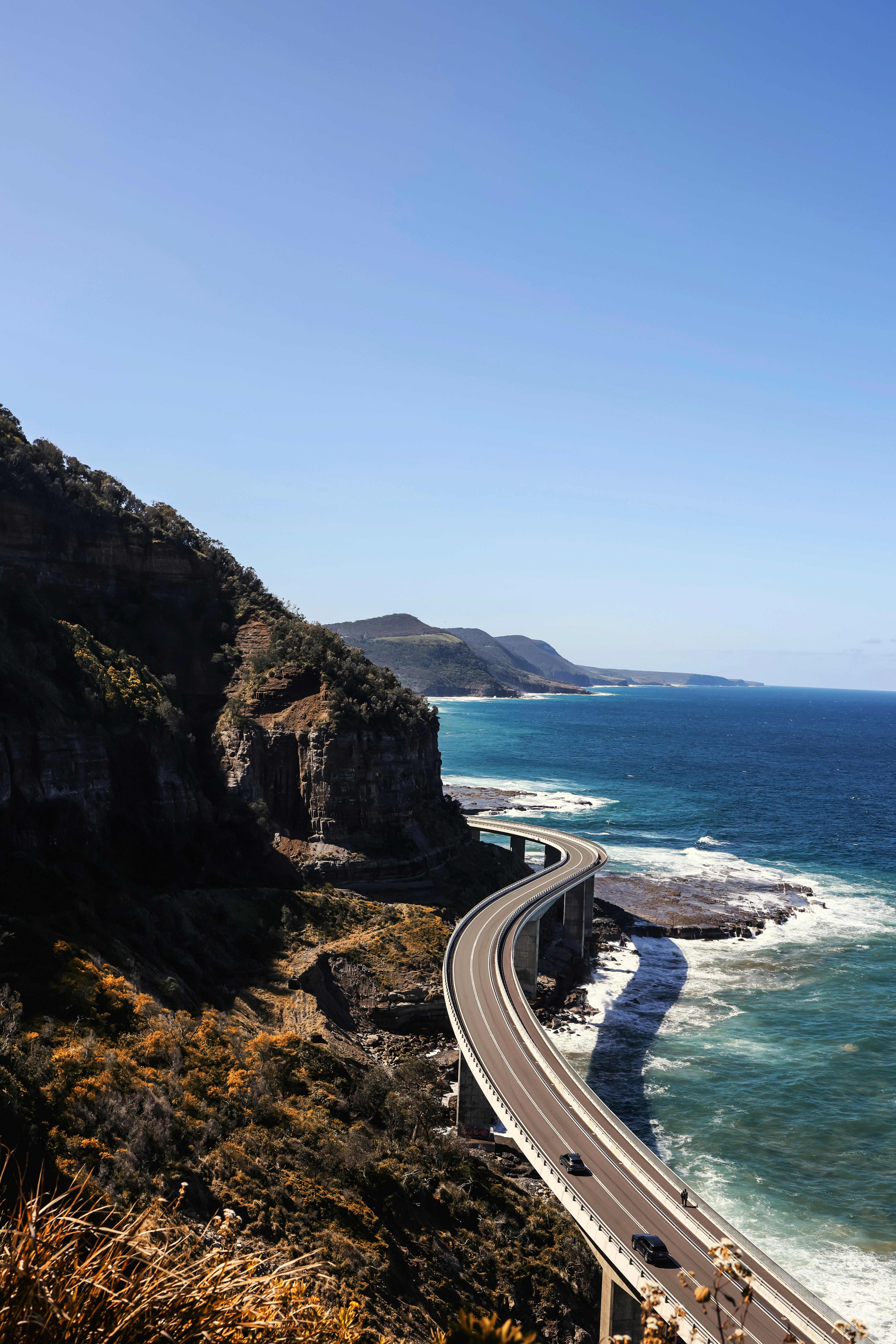 Coastline Highway: A Serpentine Bridge along Ocean Cliffs