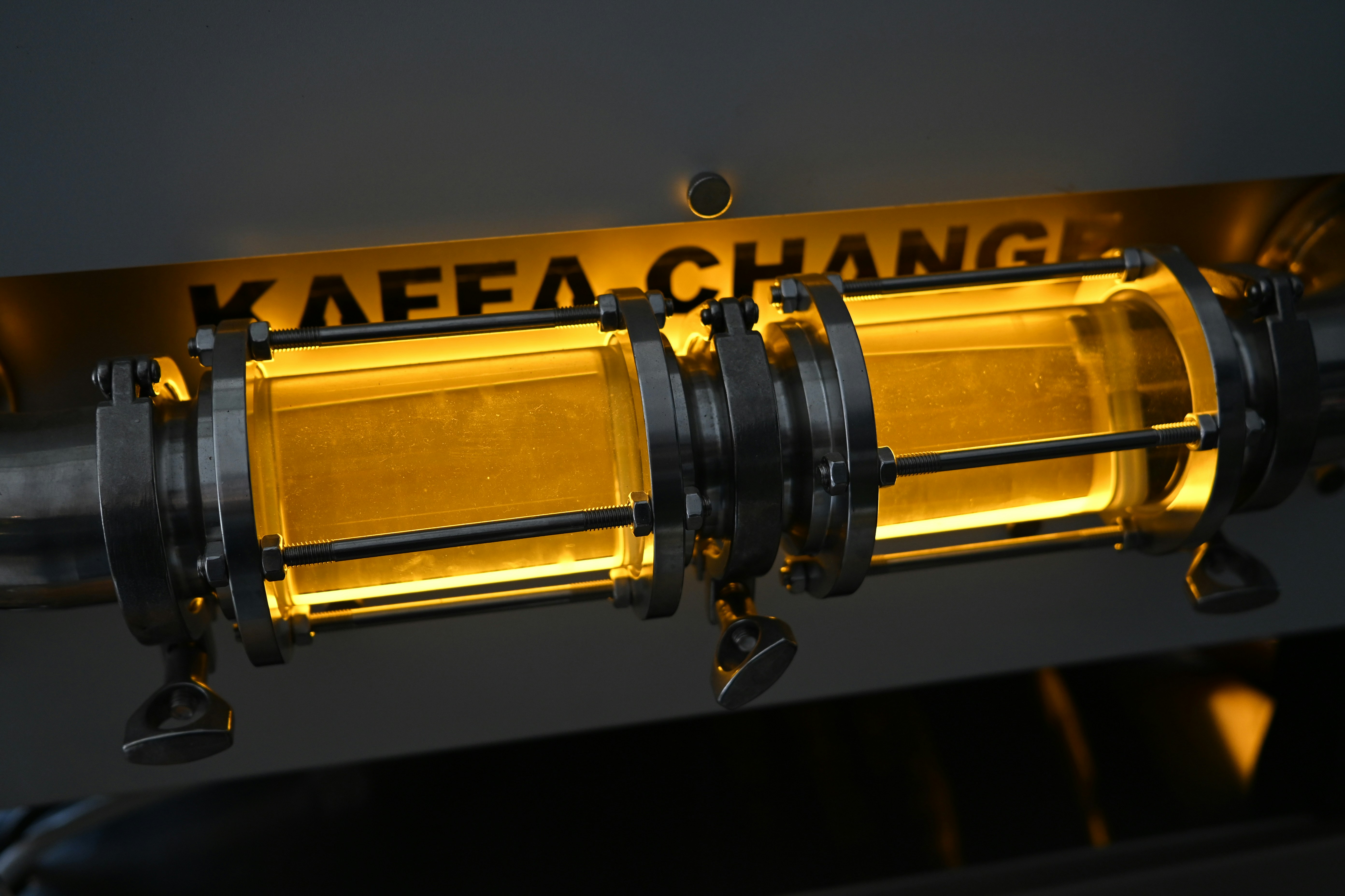 Glowing Tube Assembly: Precision Lighting in a Dark Studio