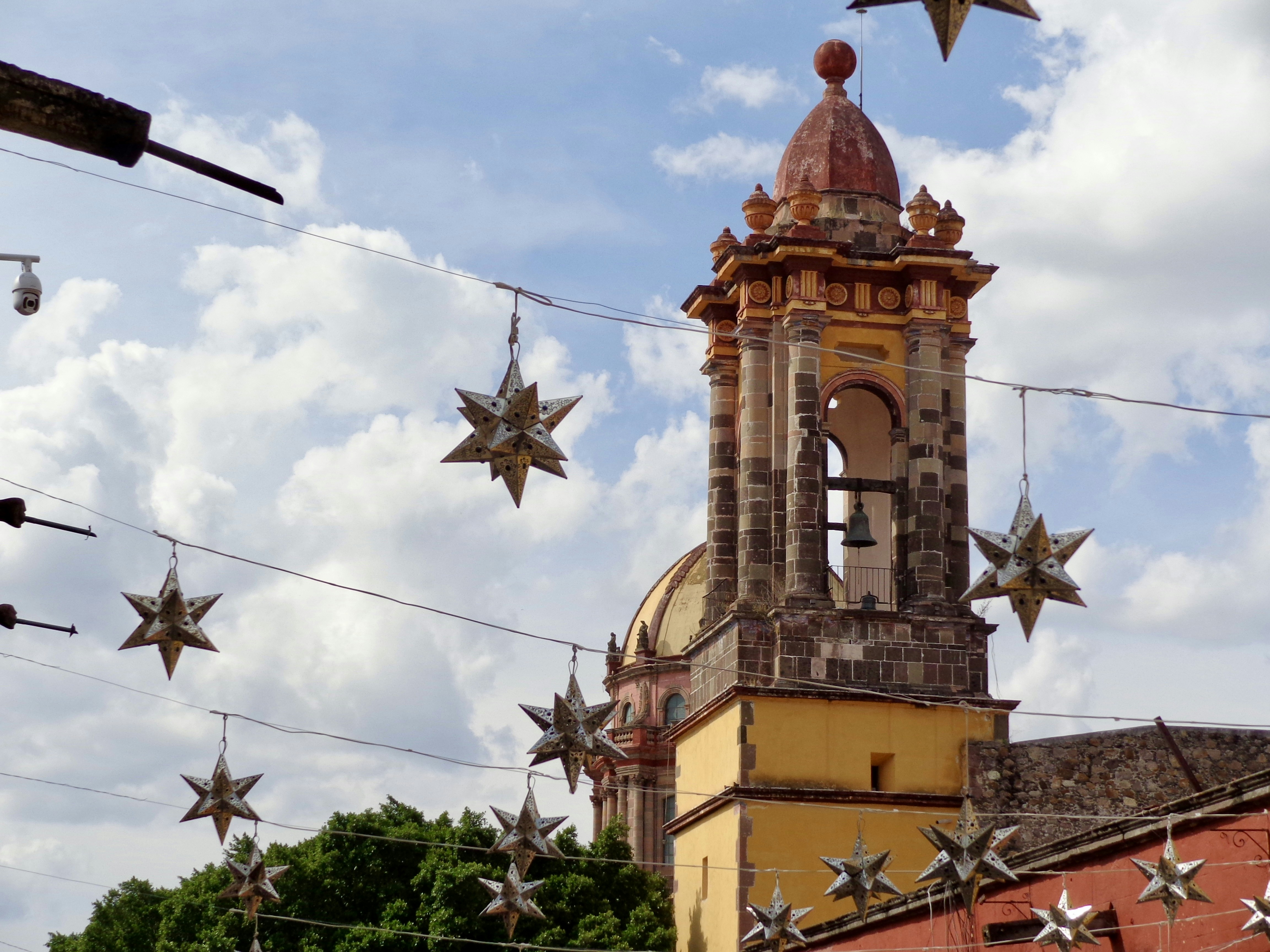 Sun-bleached Bell Tower Under Starry Ornaments