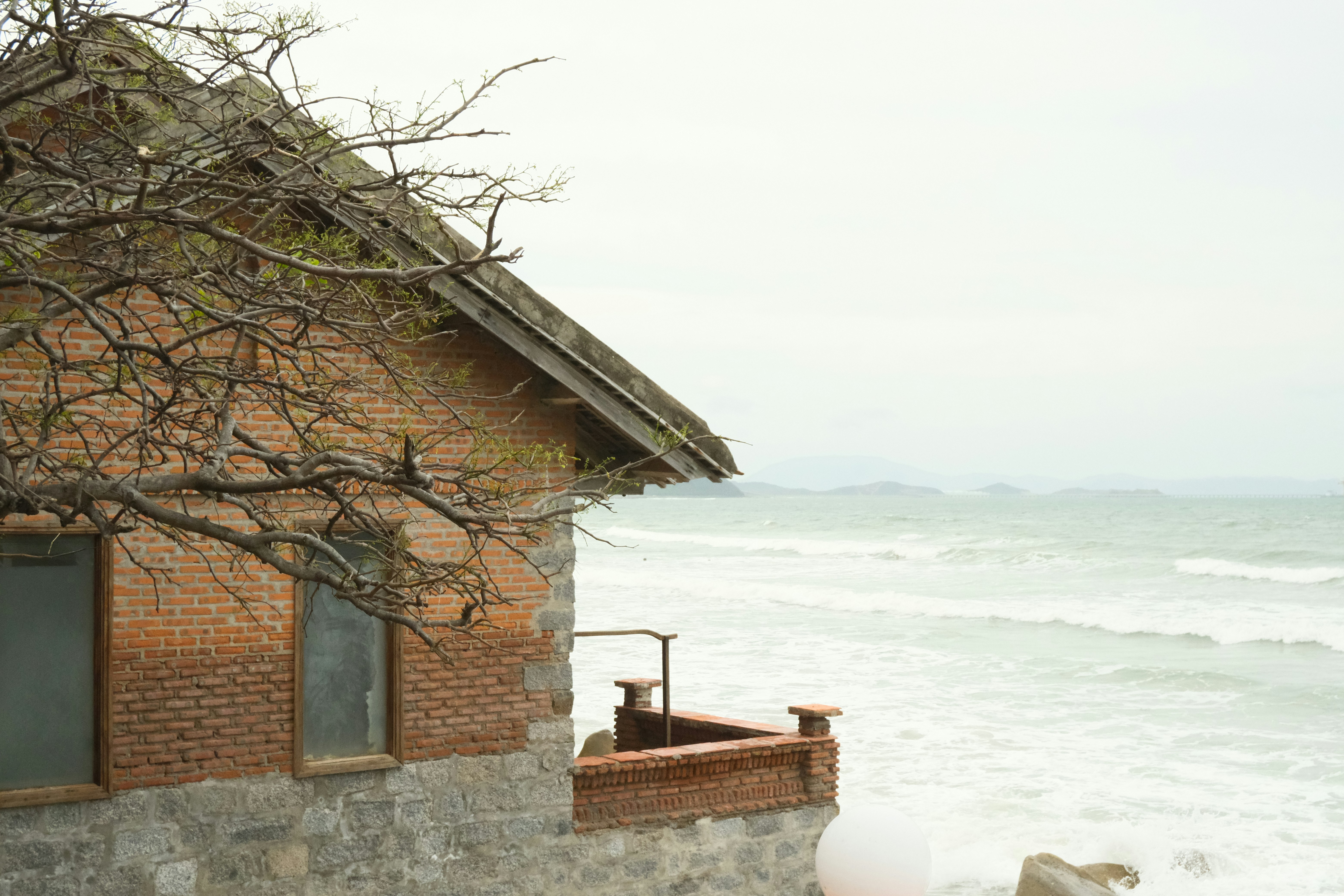 Brick Boathouse by the Sea at Quiet Dusk