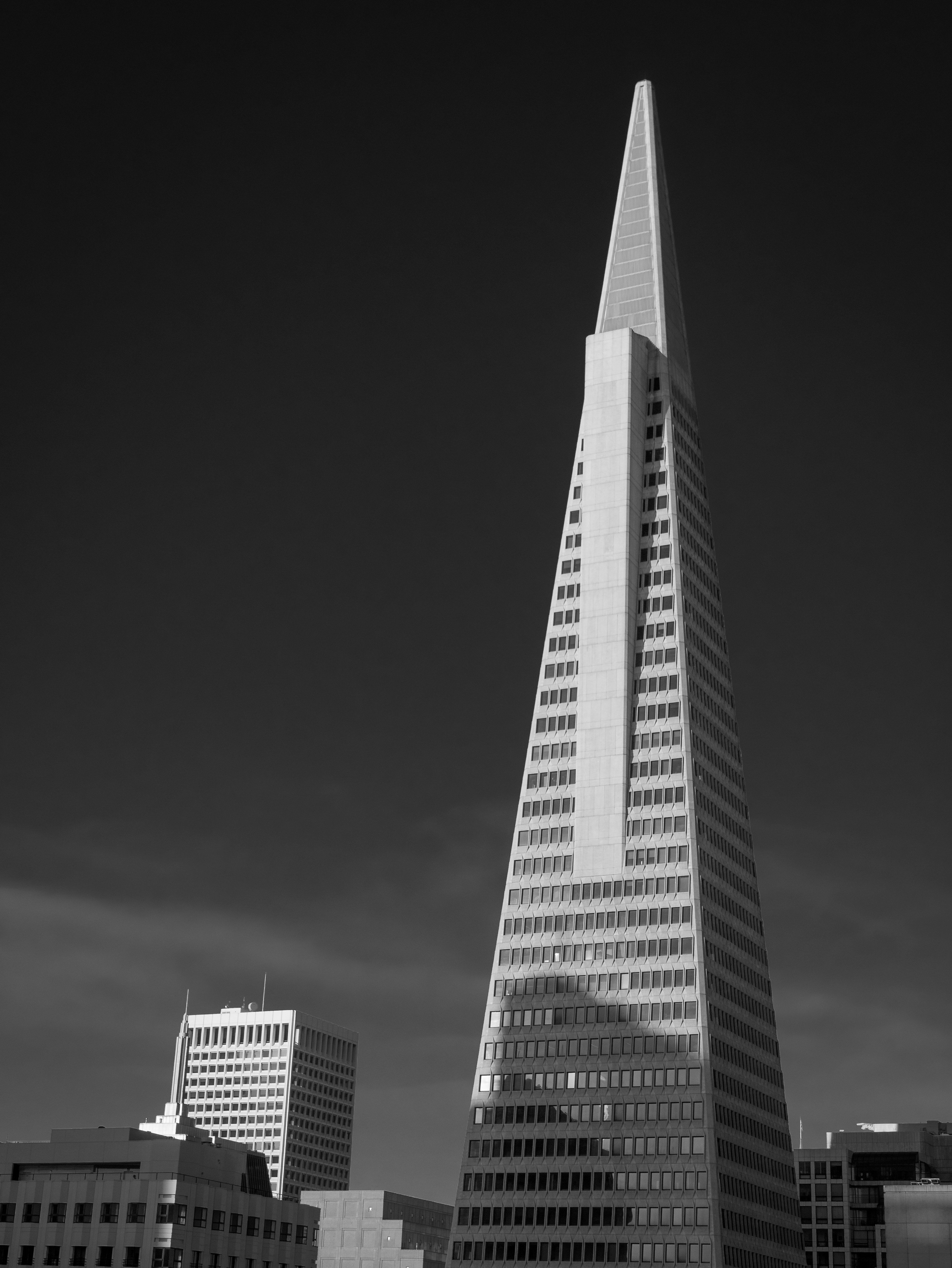 The Needle of Night: a Gilded Peak over a Quiet City