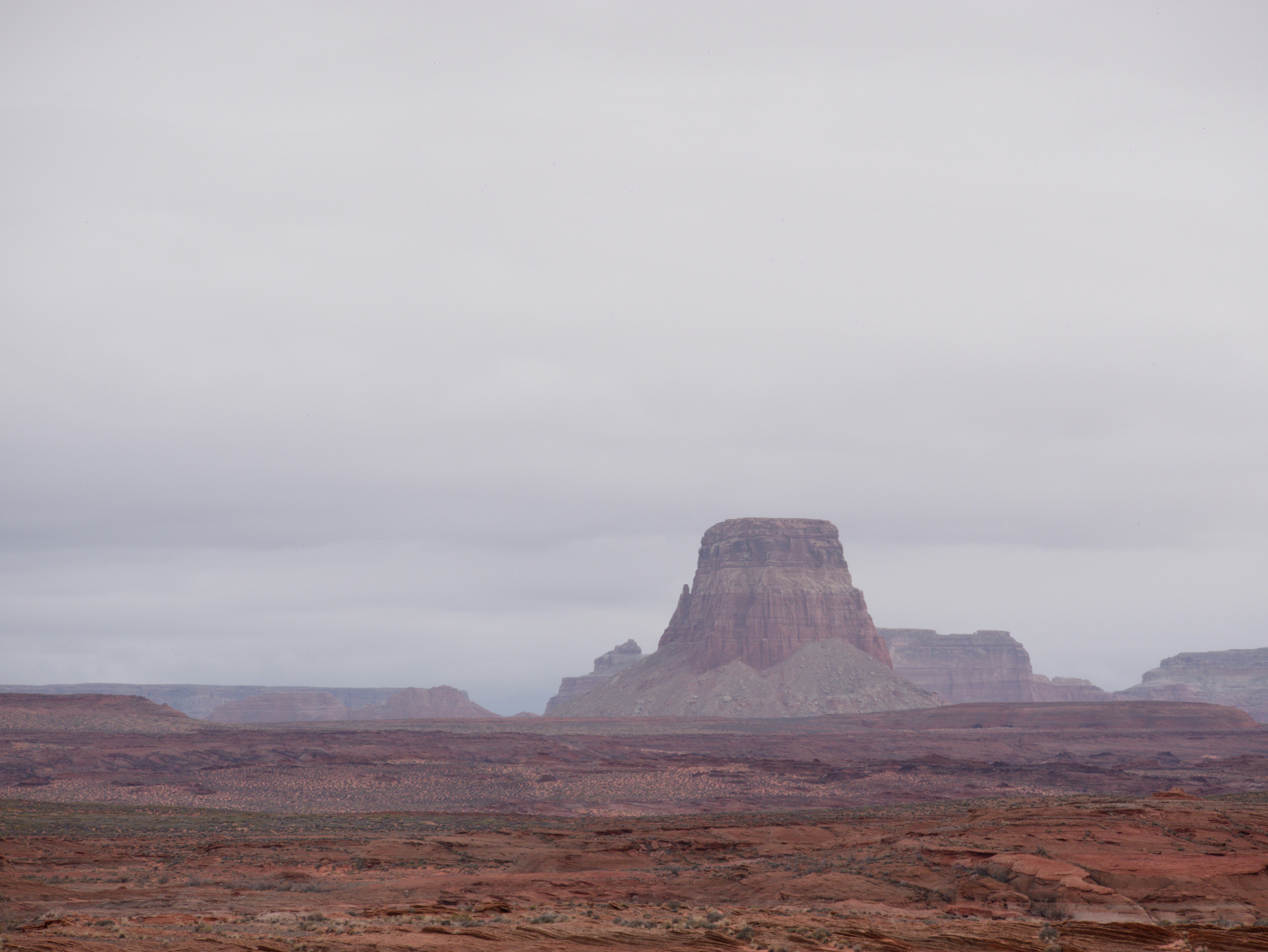 Mesa Sentinel: A Lone Butte Rising from Desert Layers
