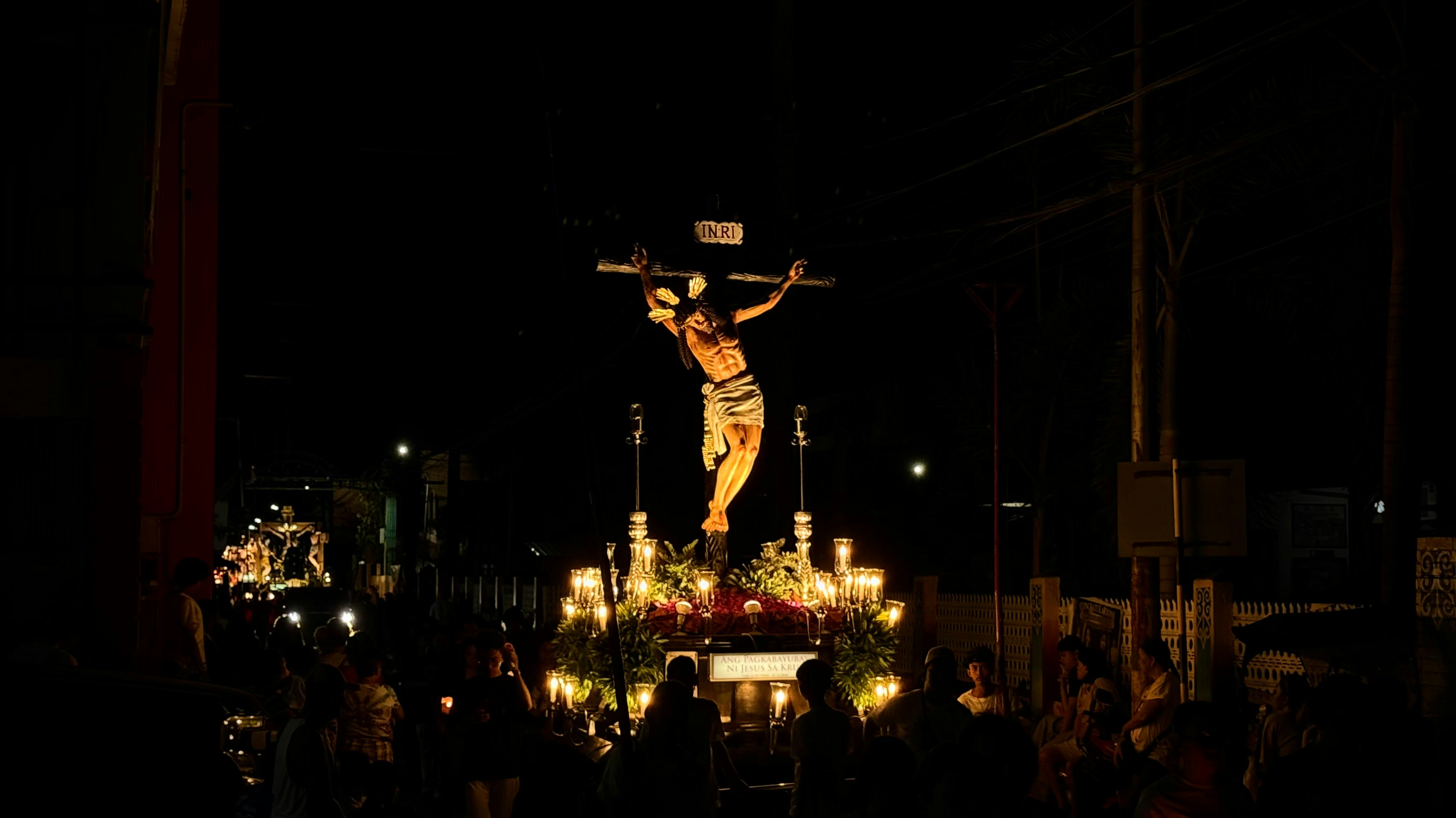 Crucifixion on a Midnight Float: A Lantern-lit Procession