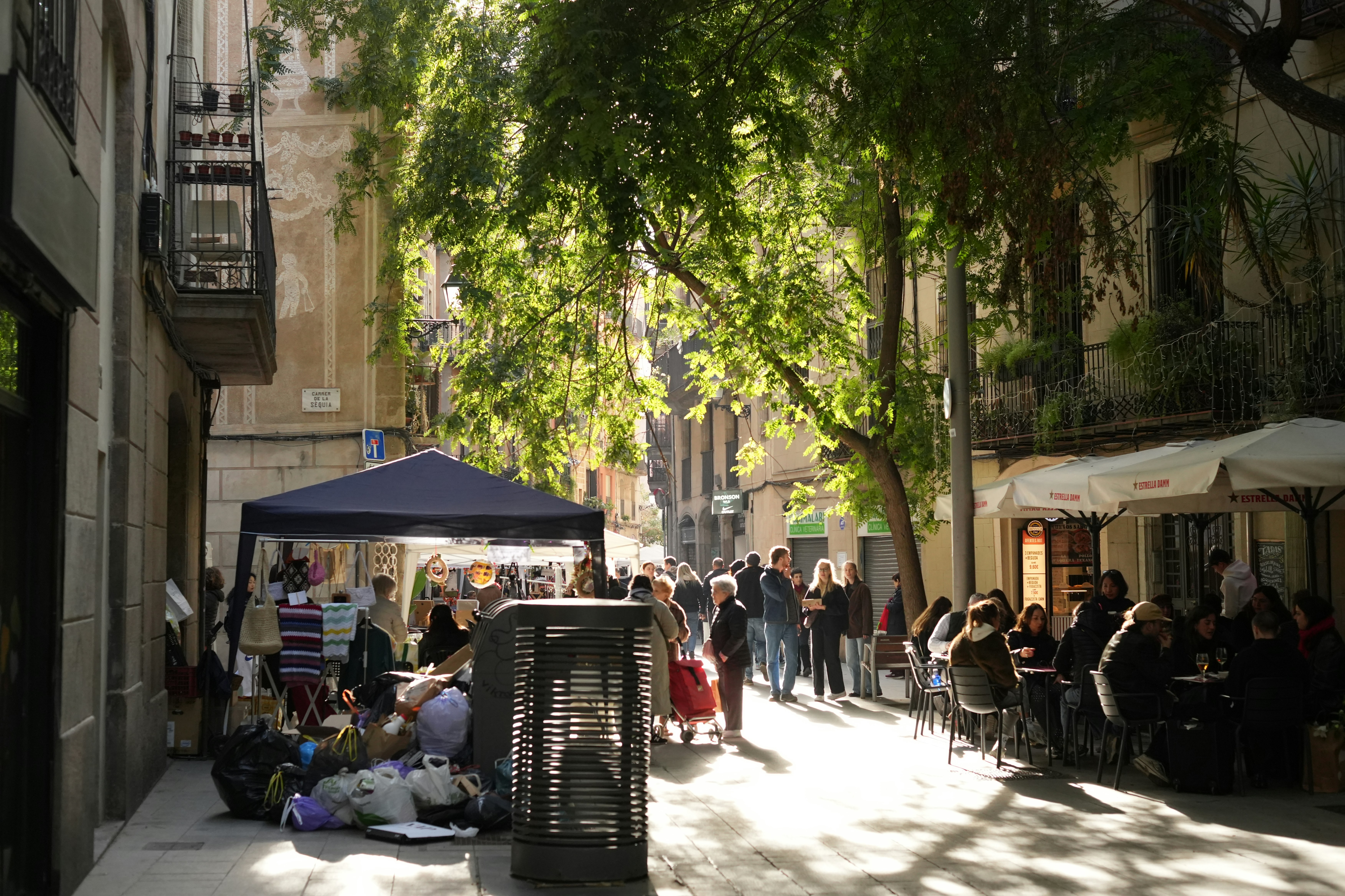 Sunlit Arco Street: Cafés, Courtyards, and a City Pulse
