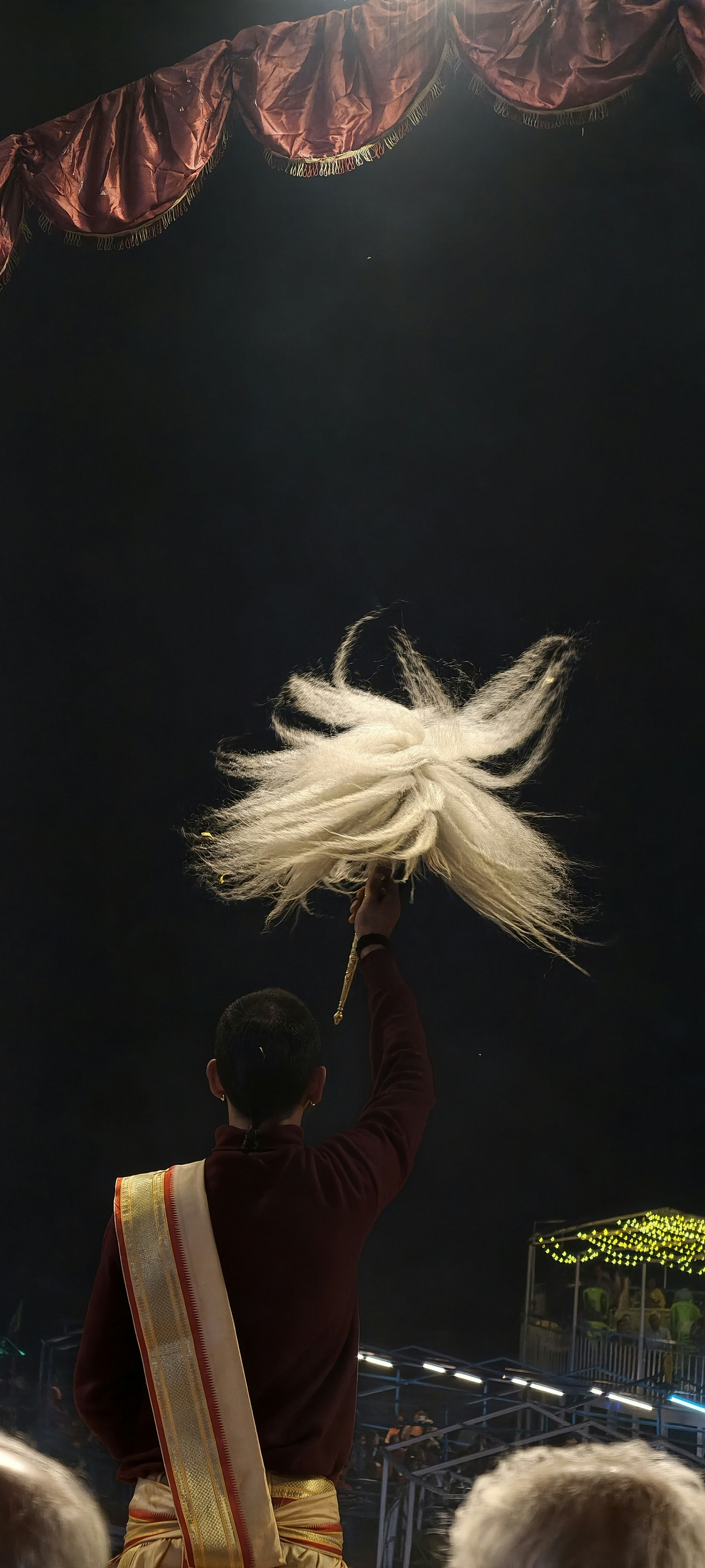 Whirling Hair and a Marching Silhouette on Stage