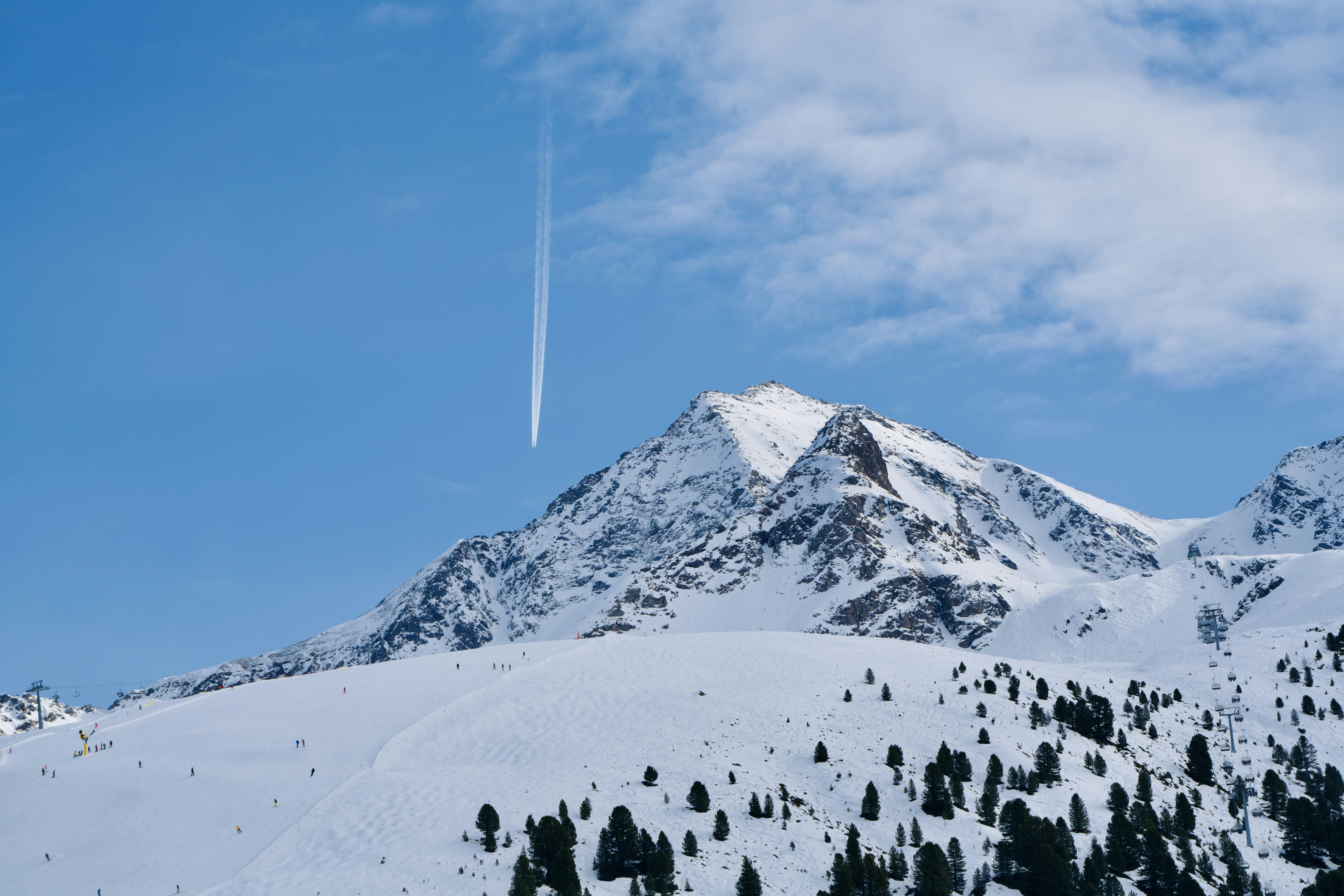 Snow-Burnished Peak under a Lined Sky