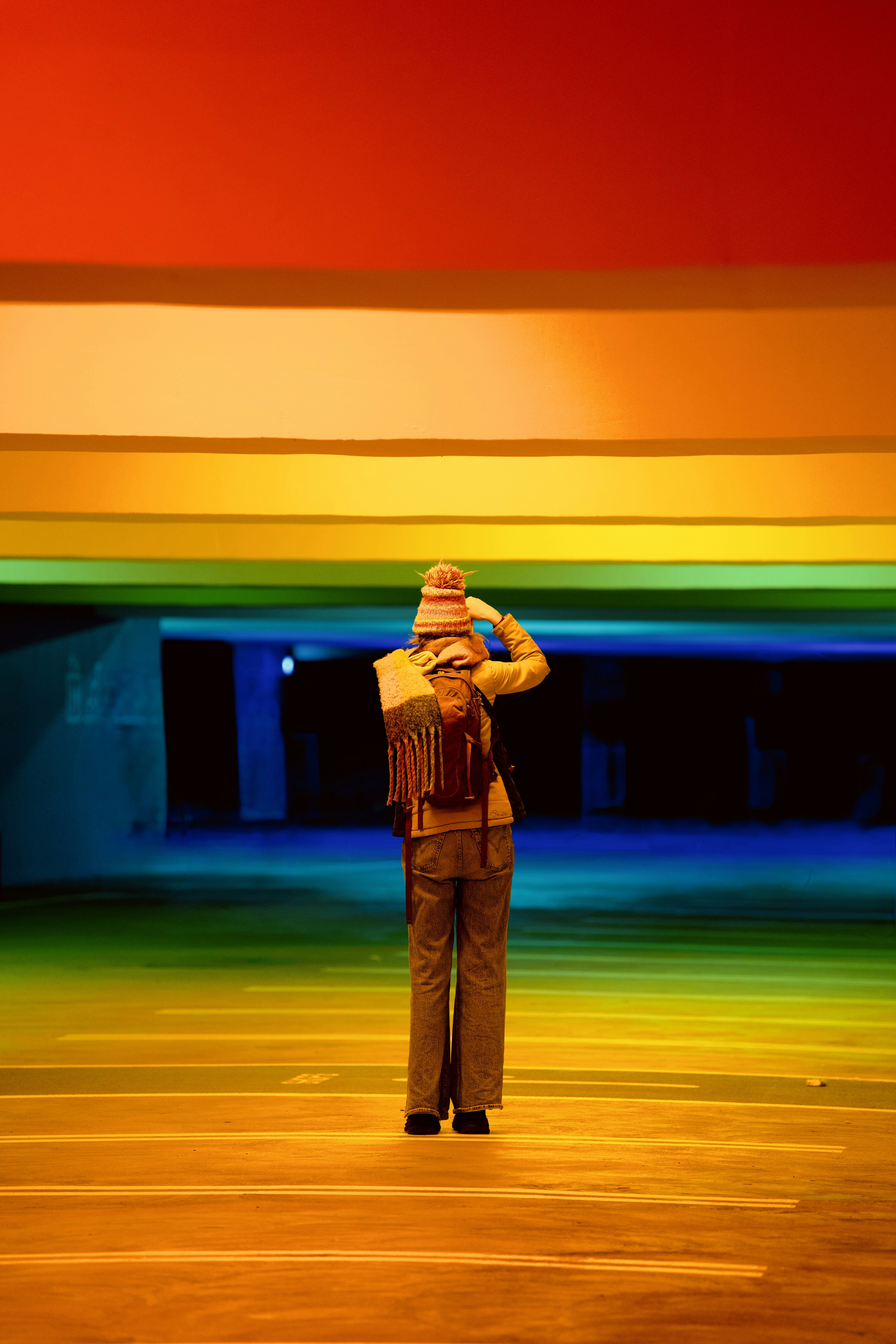 Color Pulse in an Empty Parking Garage: A lone traveler salutes the spectrum