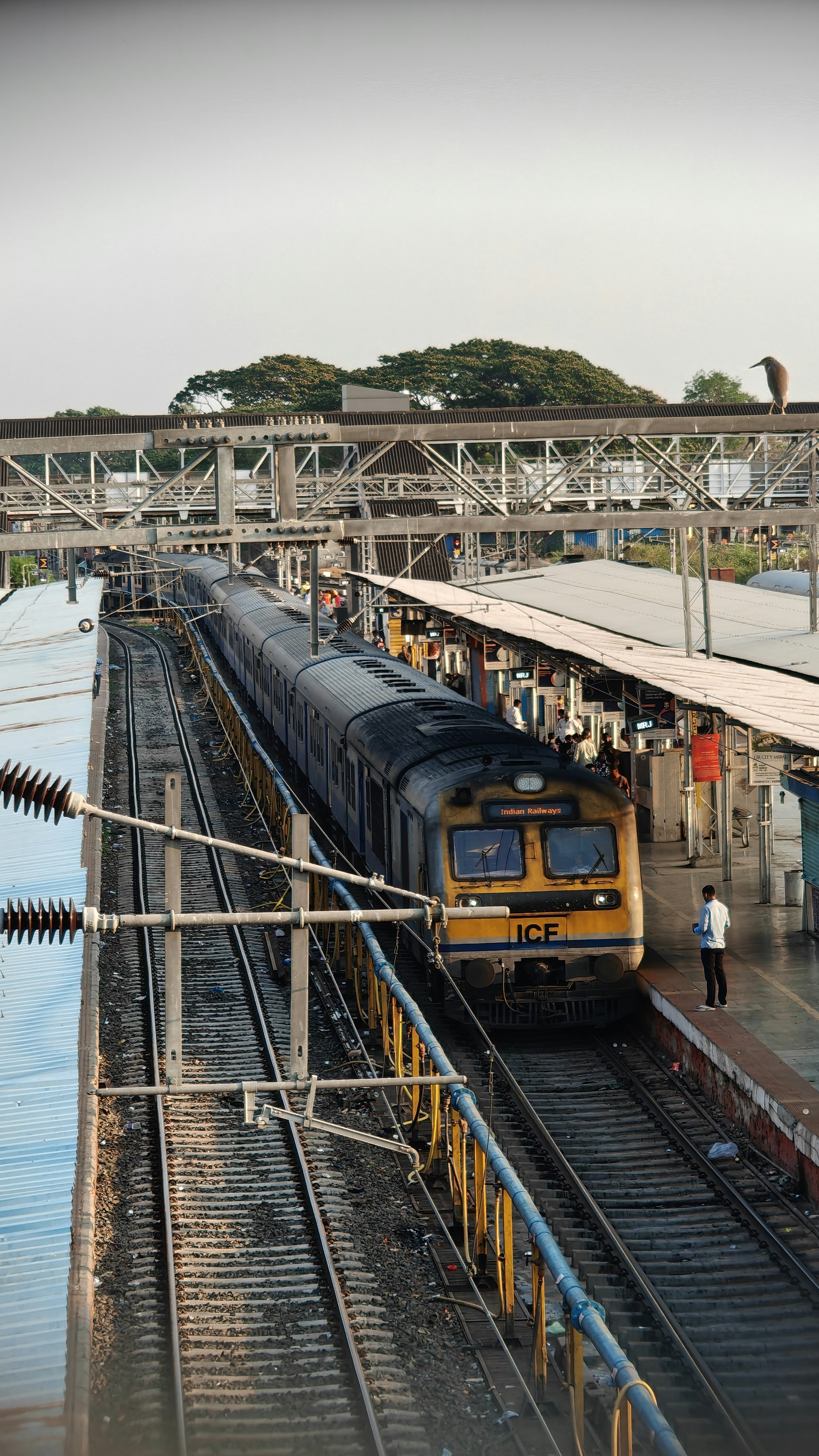 Train at the Crossing: Aerial Perspective Over the Platform