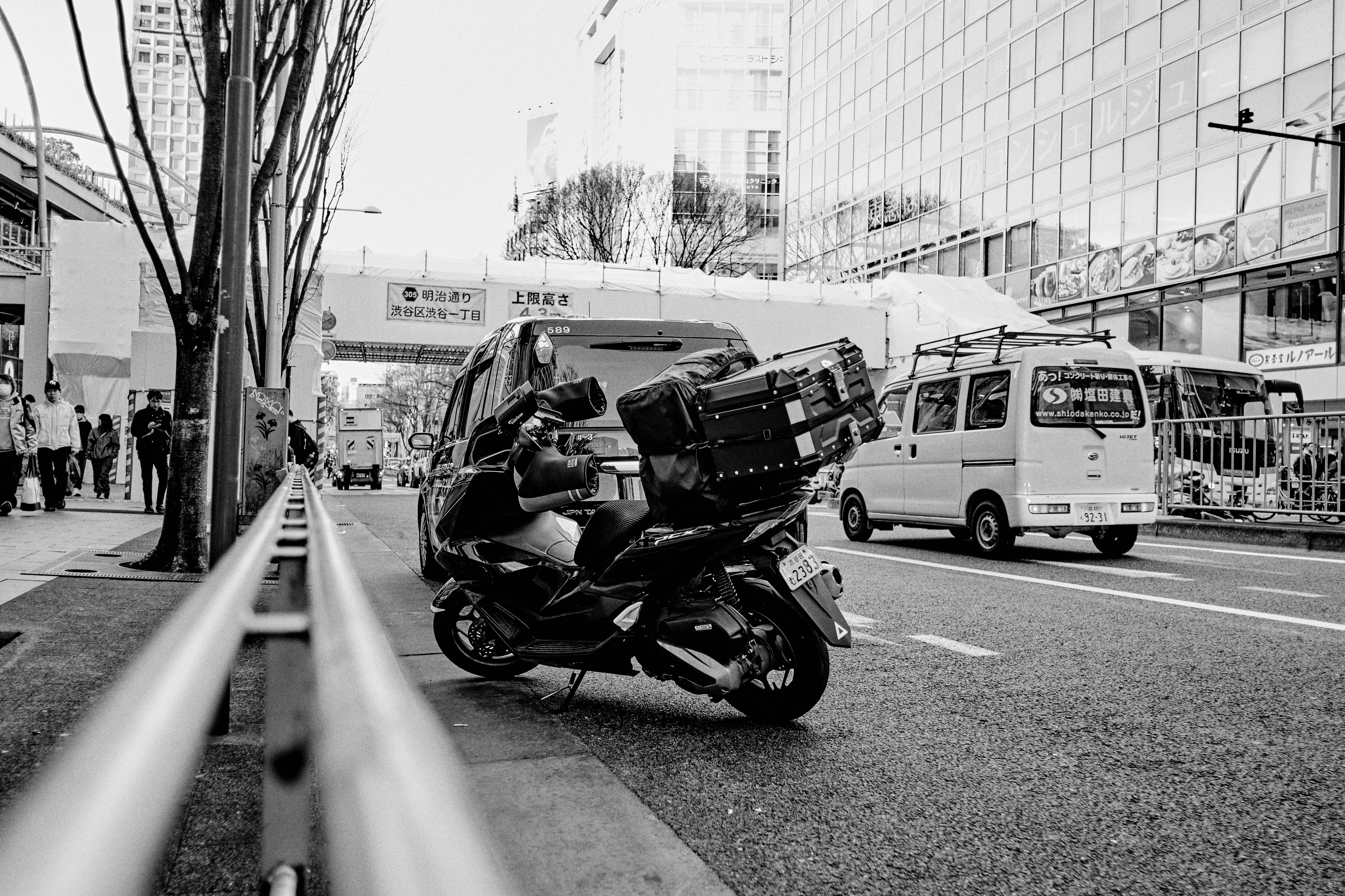 Roller-guarded Street: A Motorcycle Stalls at the Edge of the City