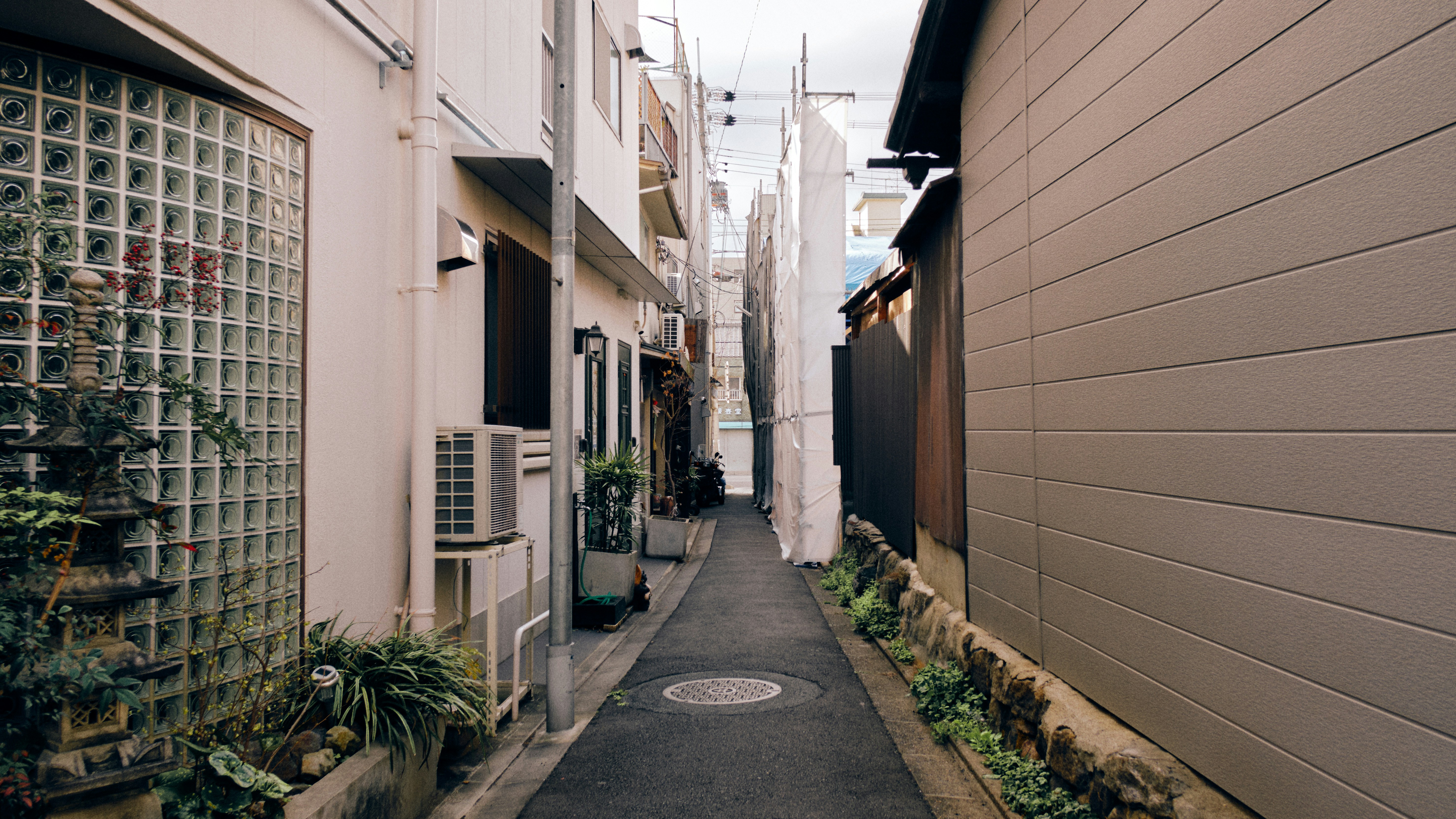Narrow Street Corridor: Quiet Urban Tapestry Between Buildings