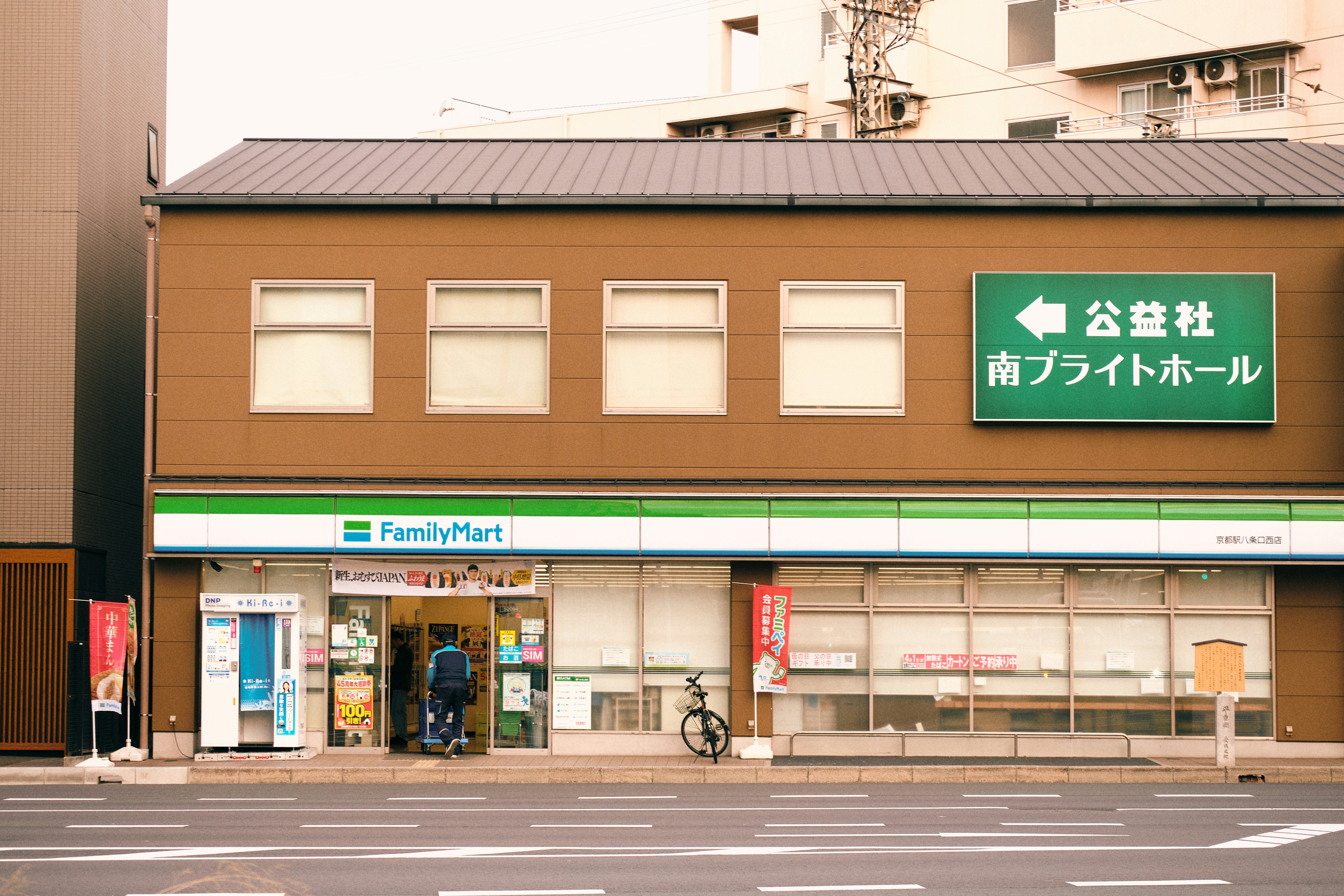 Run-down Convenience: A Quiet Streetfront with a FamilyMart Sign