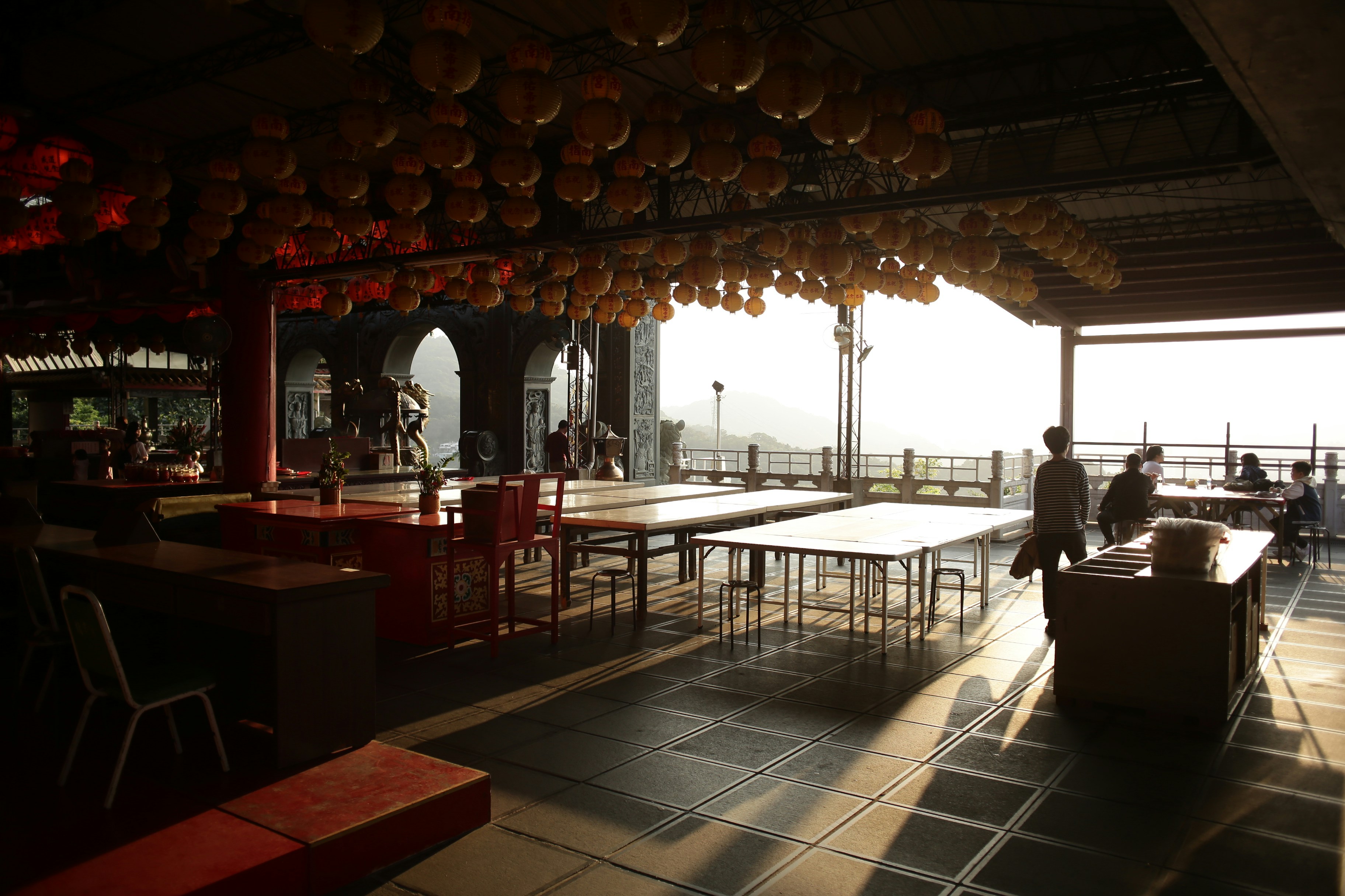 Sunlit Terrace: Lanterns, Shadows, and Open Horizon