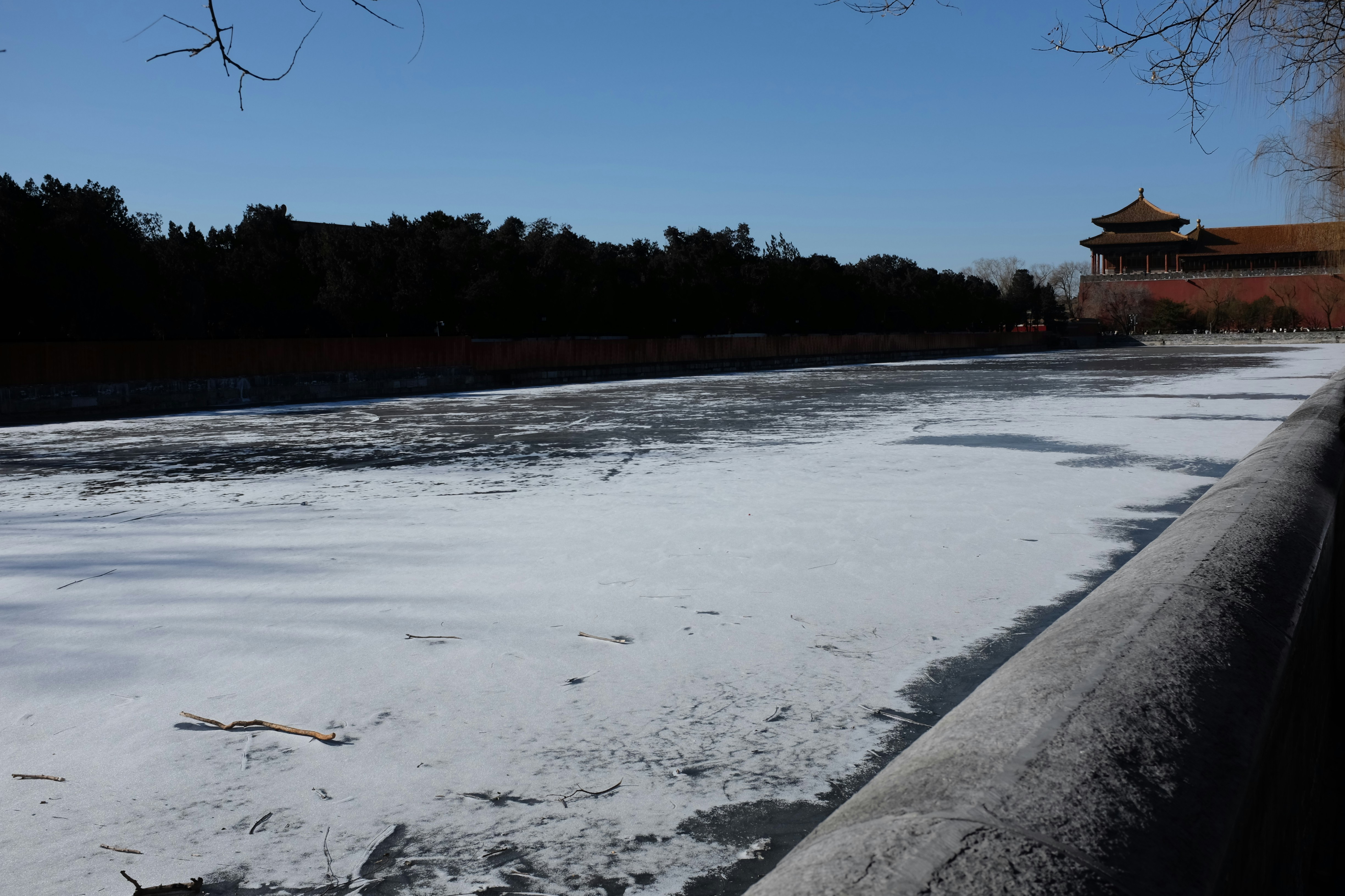 Winter Long Shadow Over the Frozen Moat