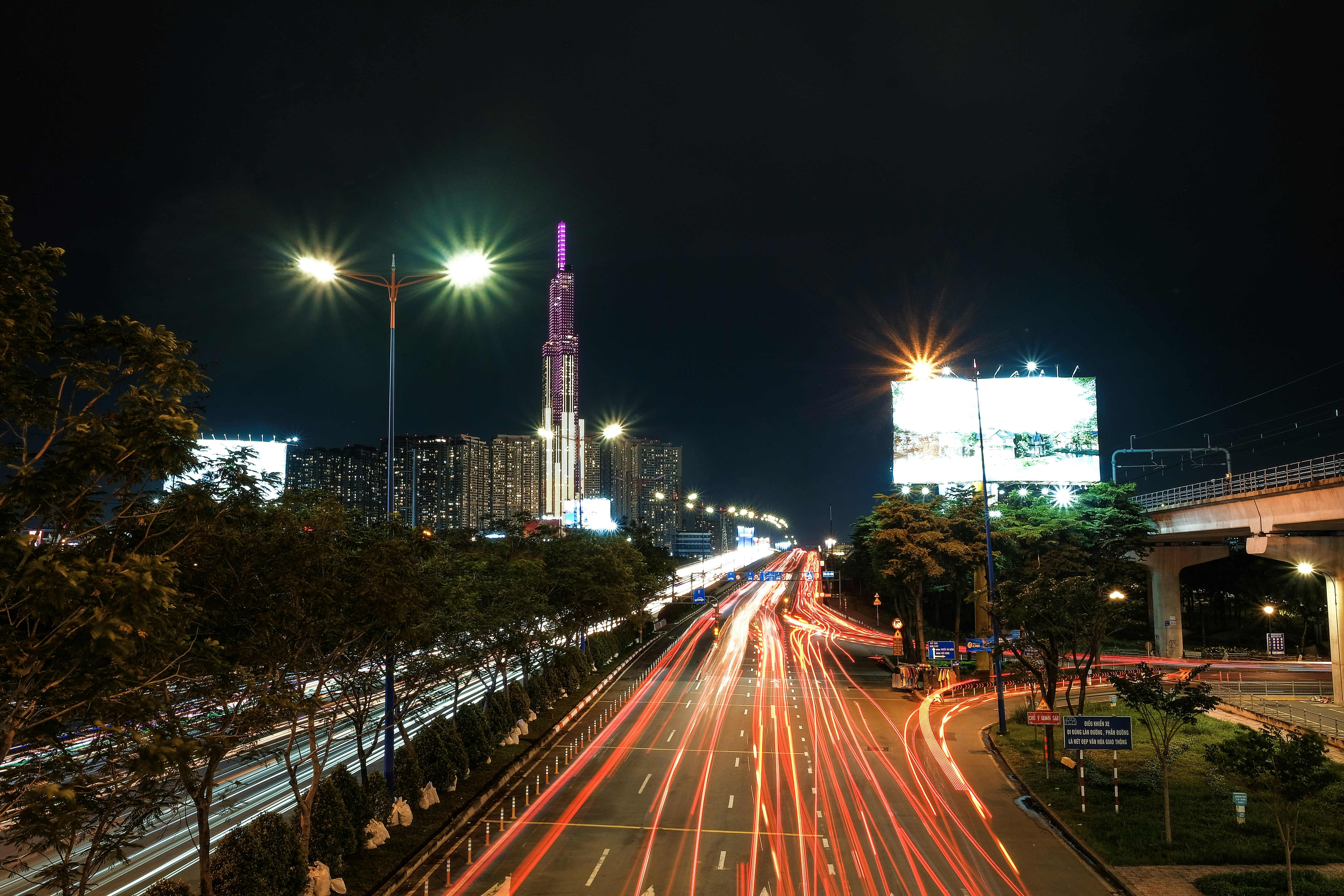 Neon Arteries: Light Trails Beneath the Skyscraper Crest