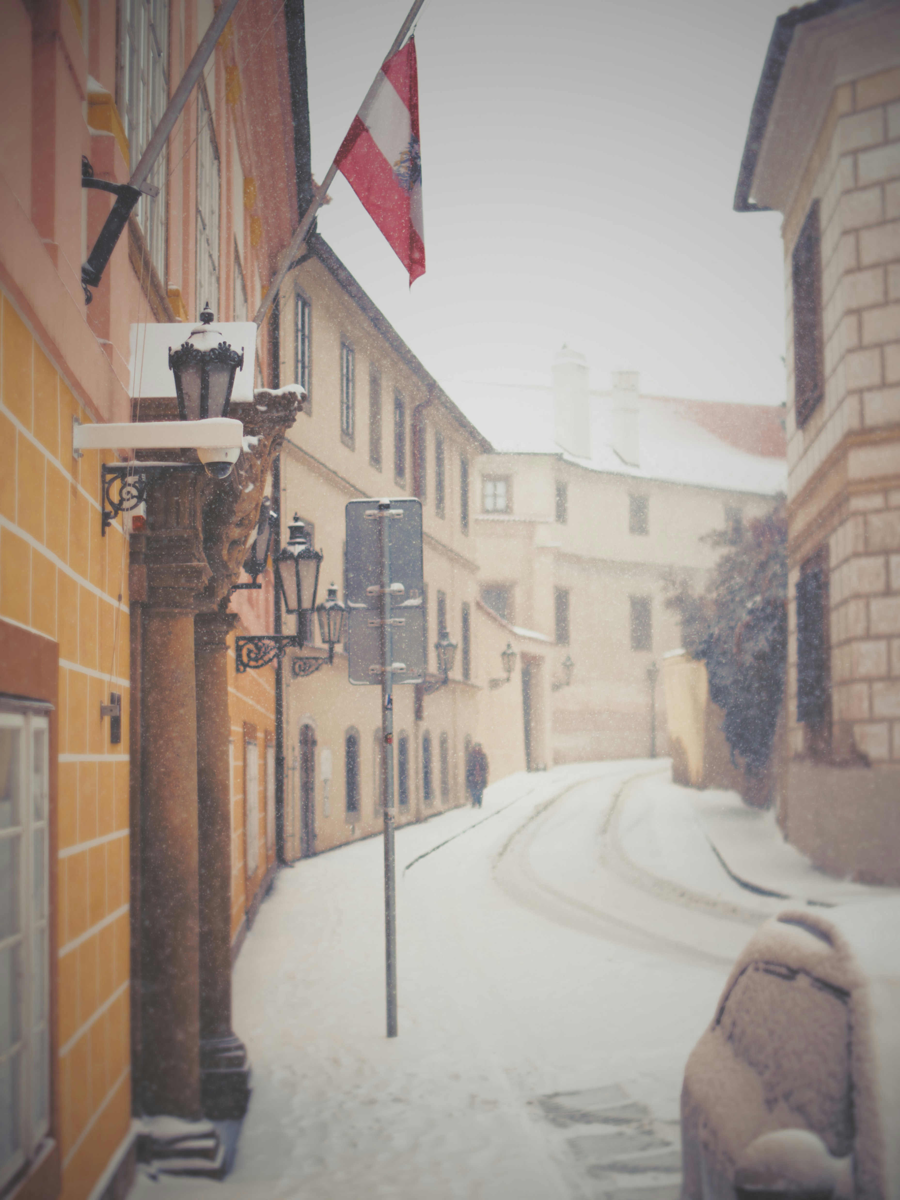 Snowy Lane in Warm Light: A Quiet European Courtyard