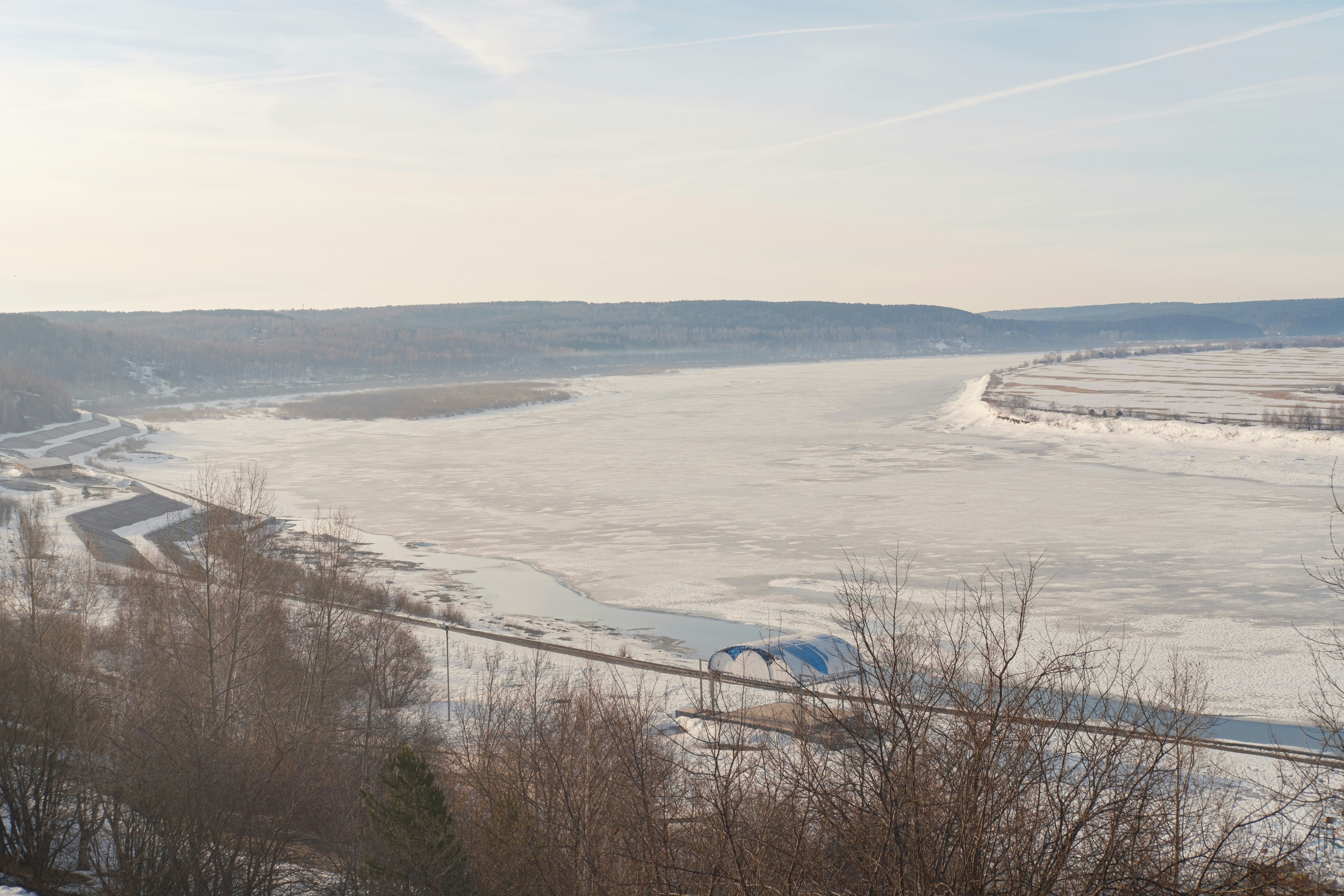 Icy River Bend Under Winter Light