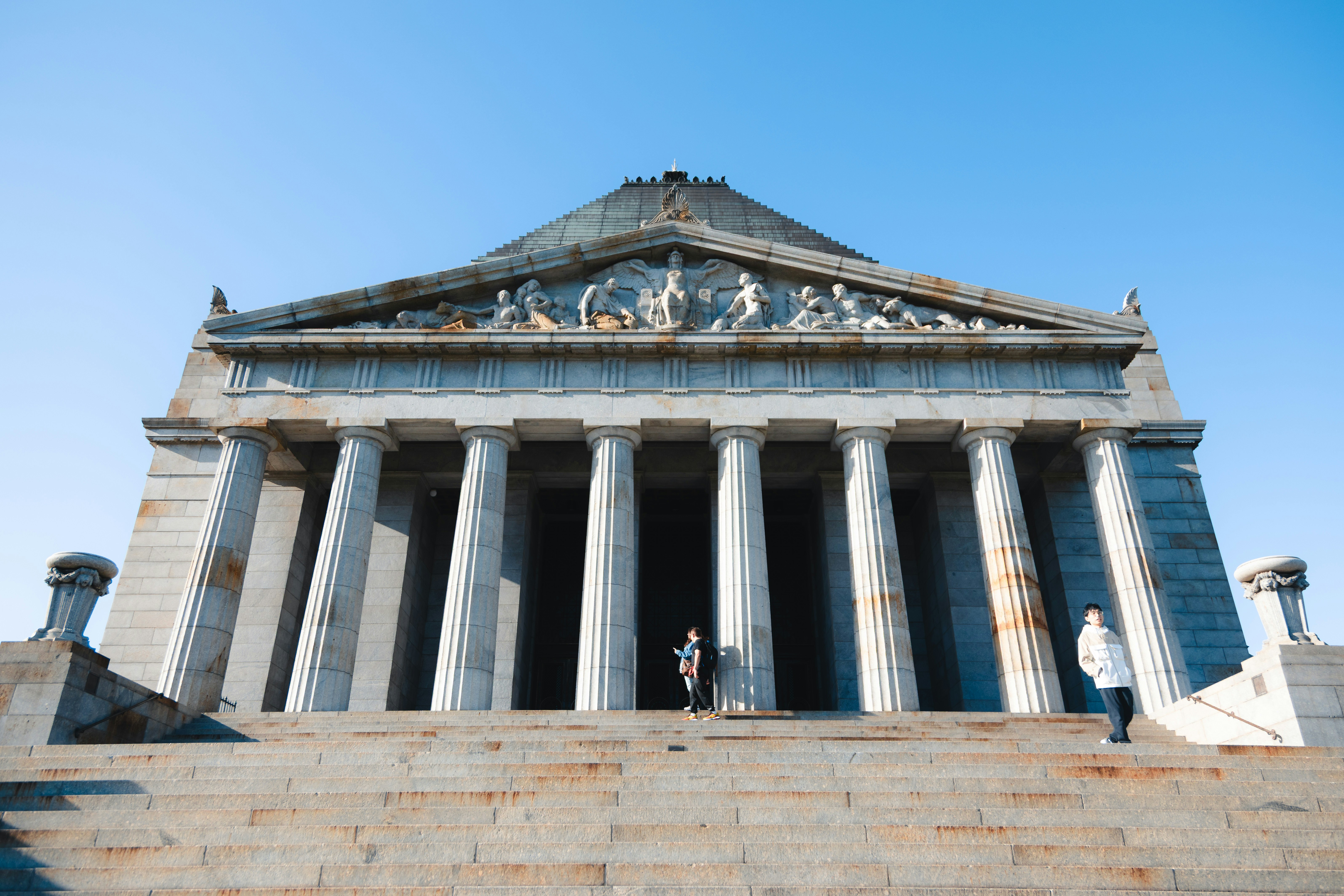 Temple of Guardians: Steps and Columns Under a Clear Sky