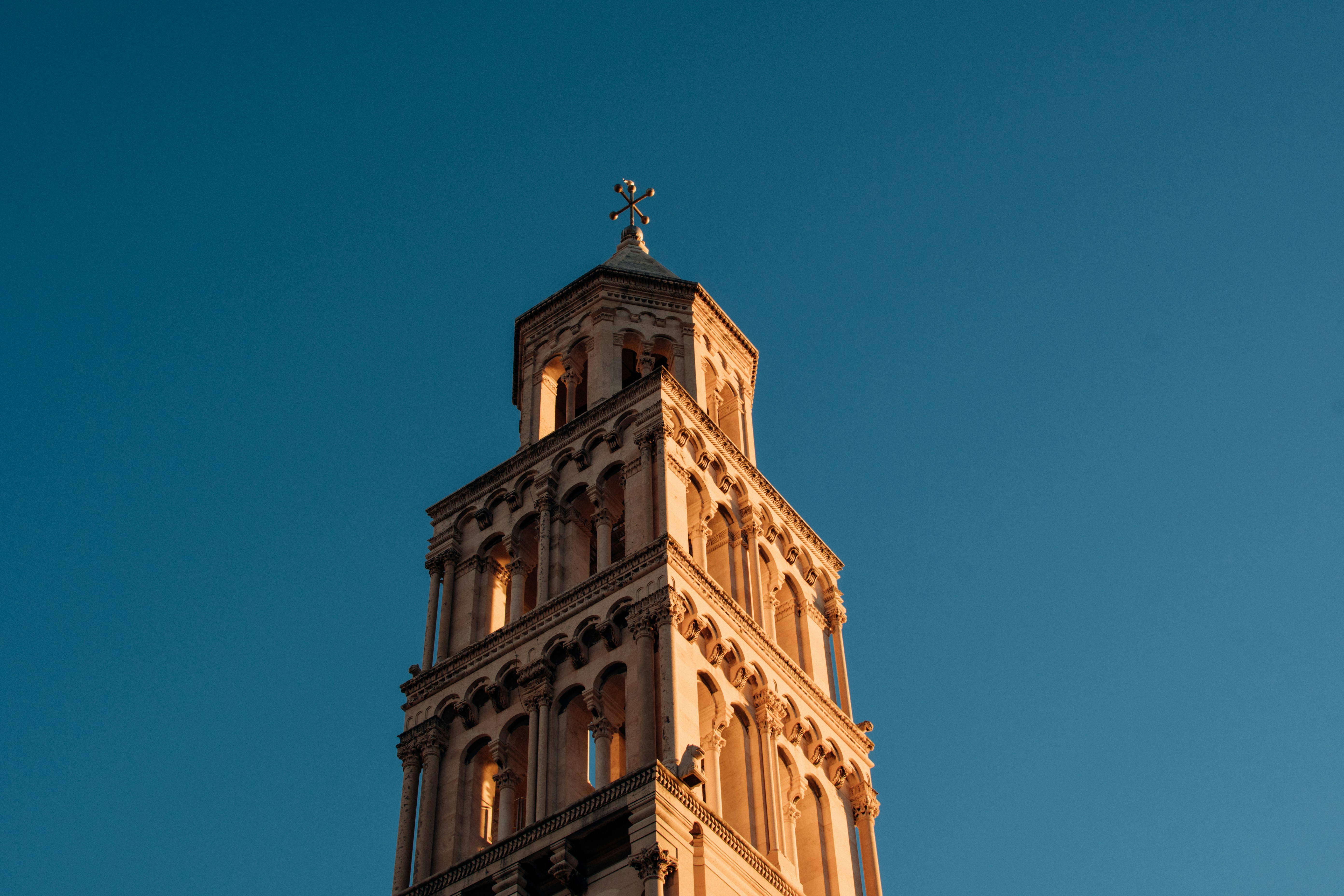 Sunlit Bell Tower Reaching Toward a Clear Sky
