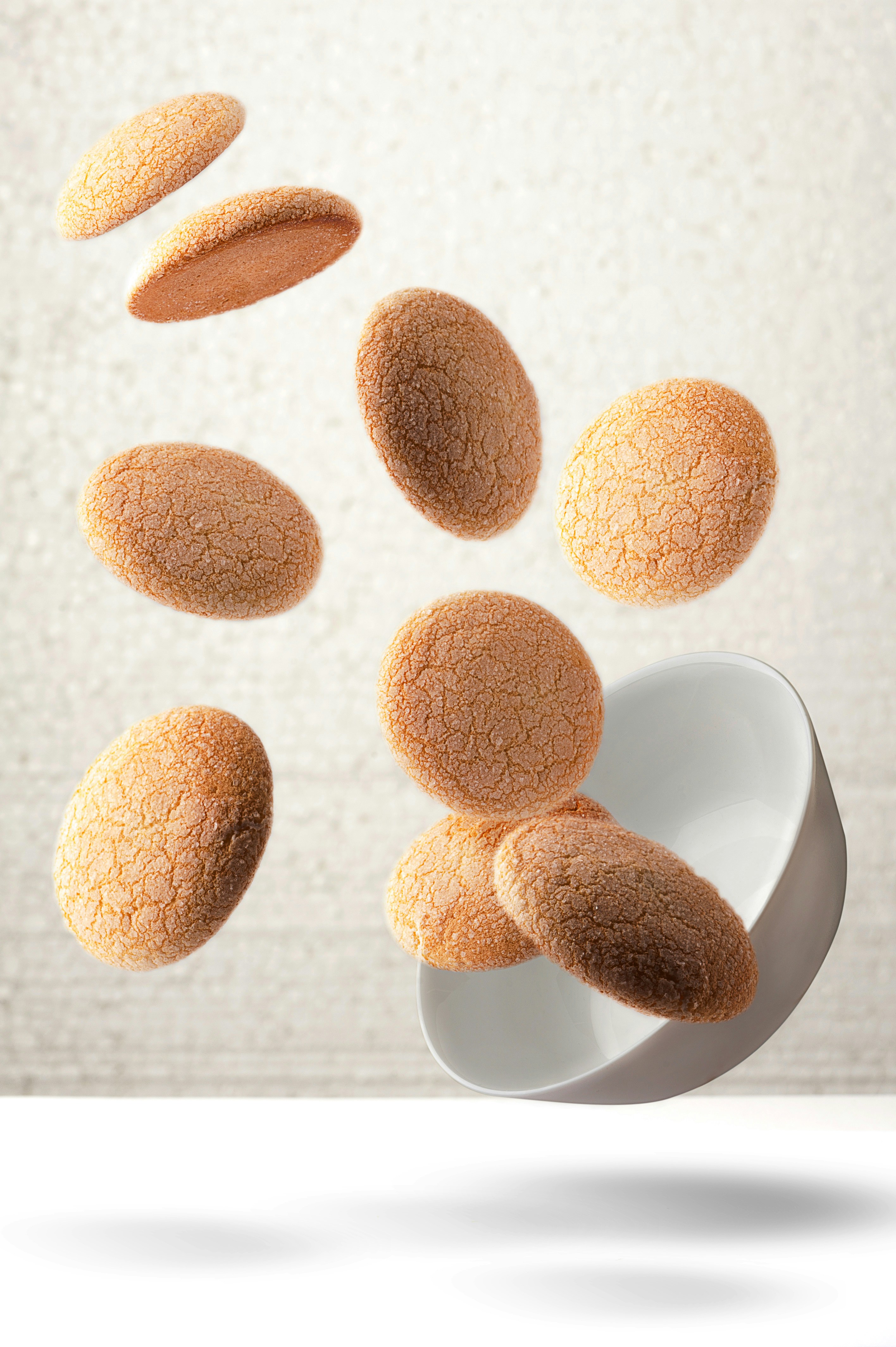 Floating Almond Cookies in a Soft Linen Backdrop