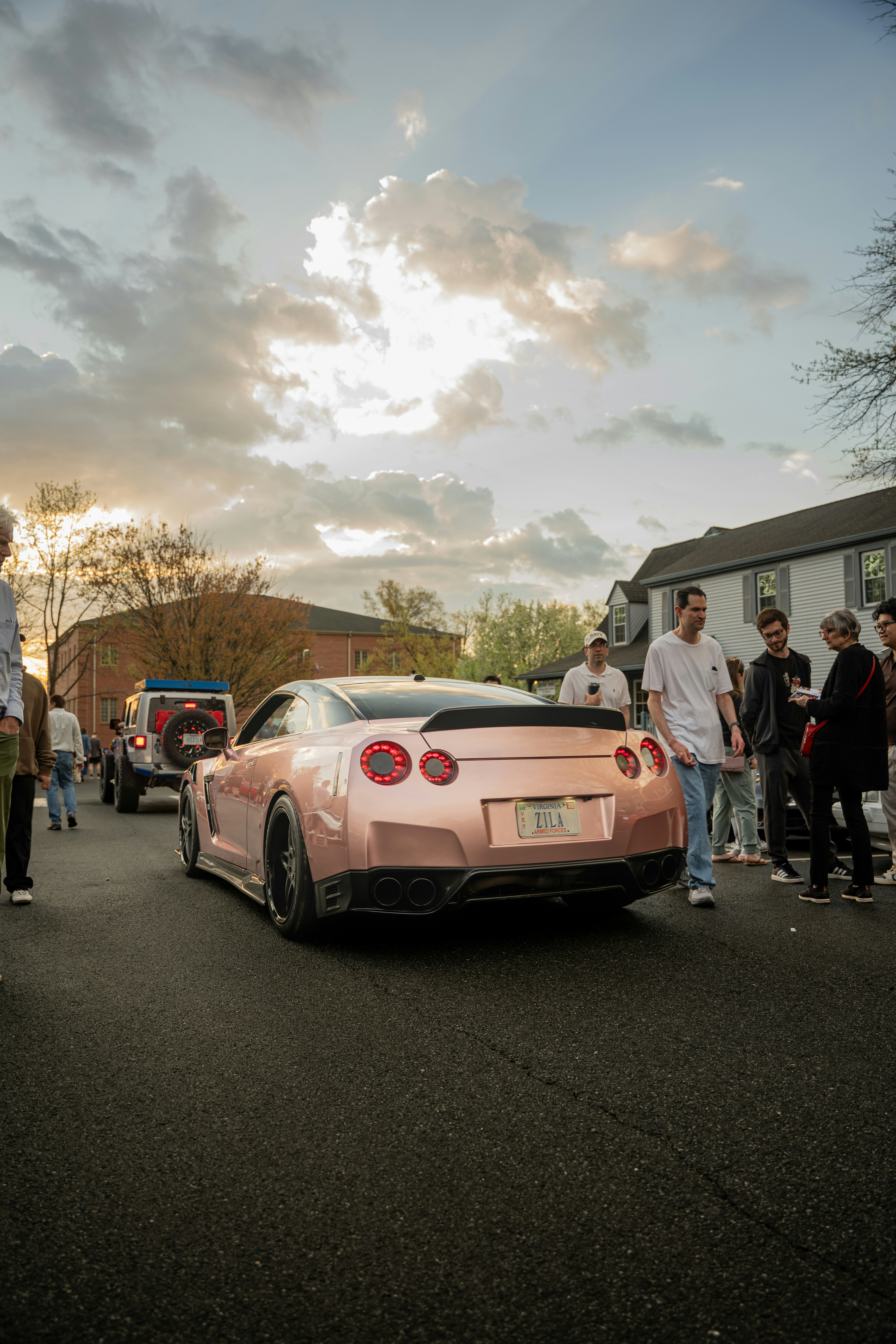 Pastel coupe in a sunset street gathering