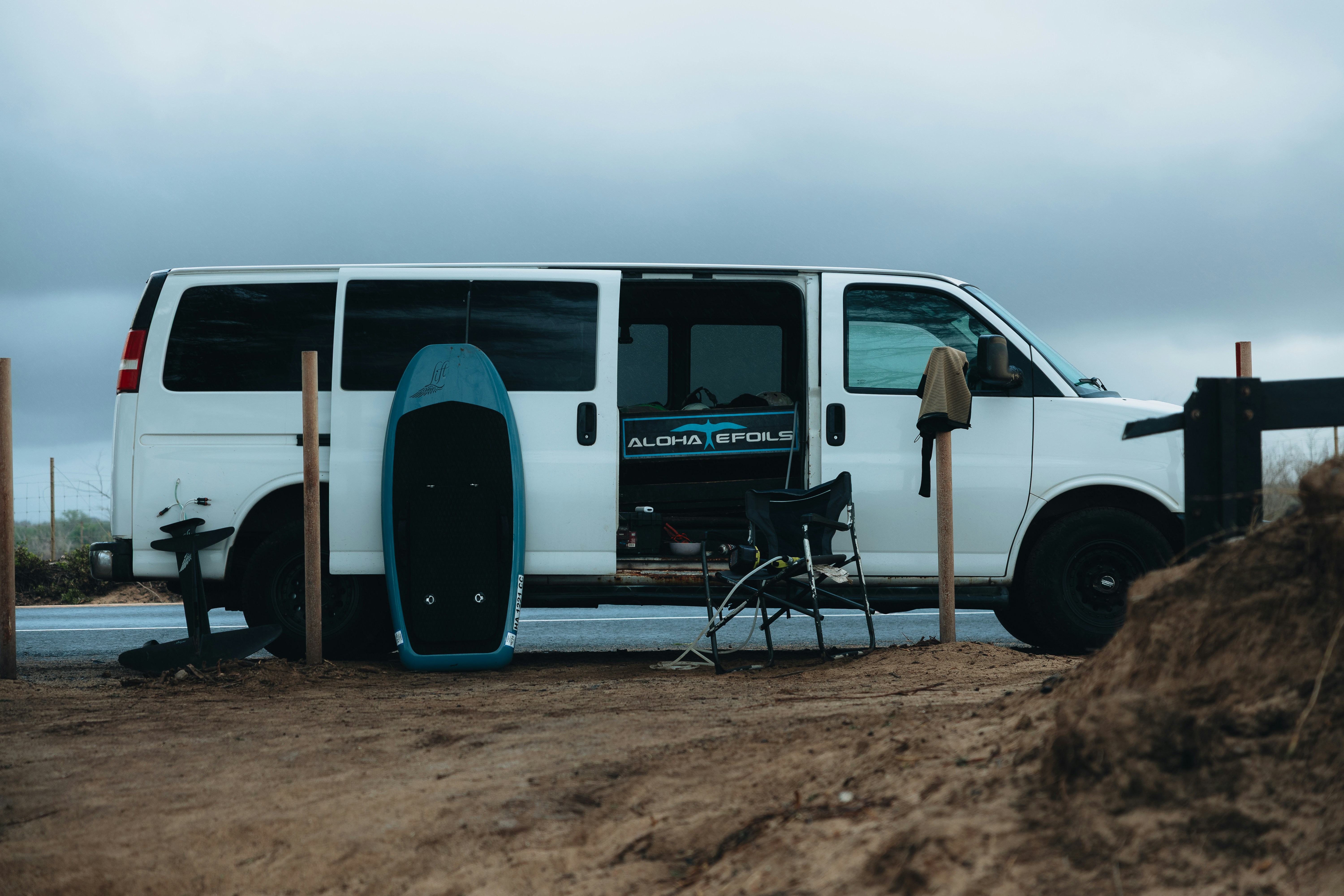 Surfboard Ready: A Quiet Beach Setup by the White Van