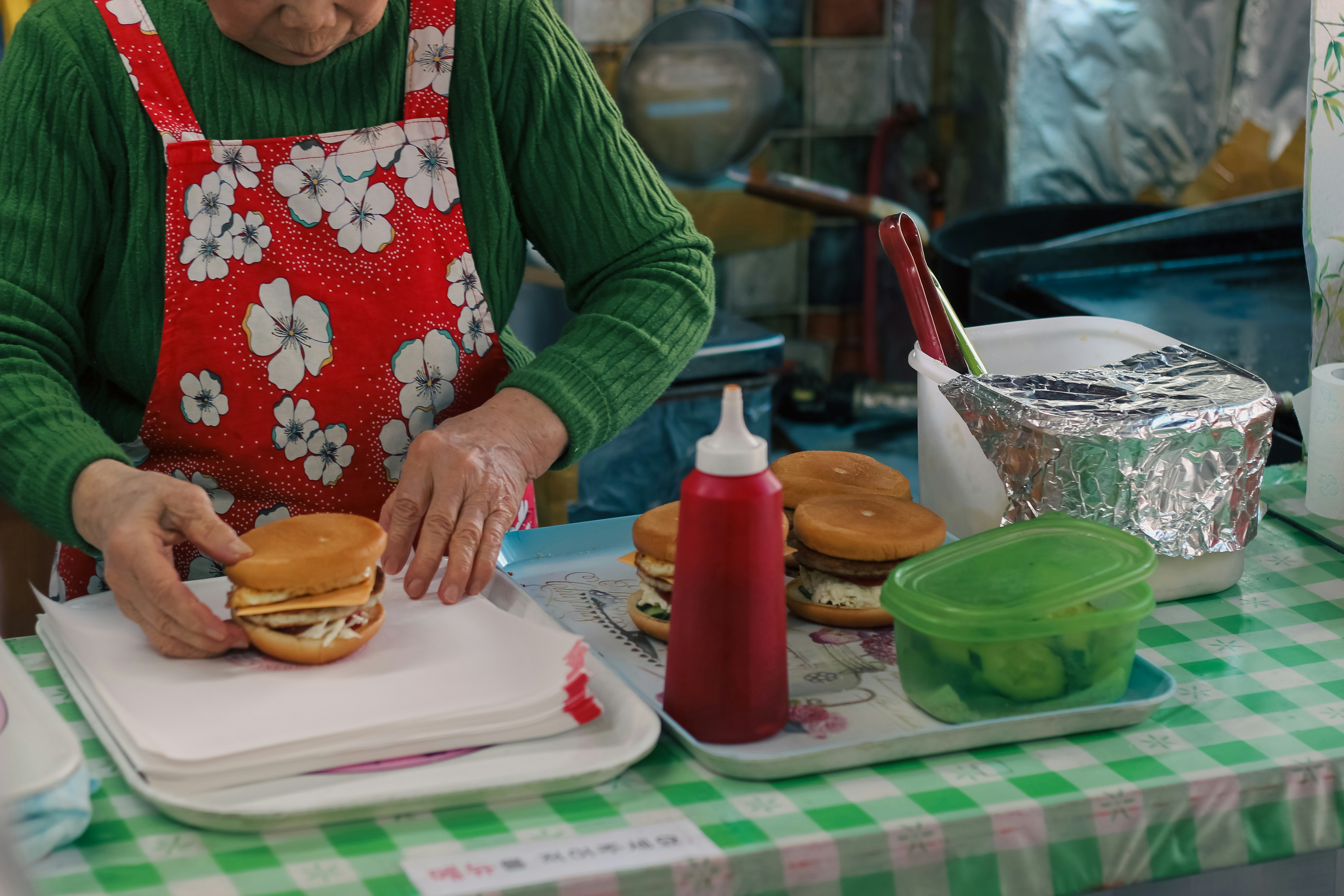 Hamburger Assembly at a Cozy Street Stand