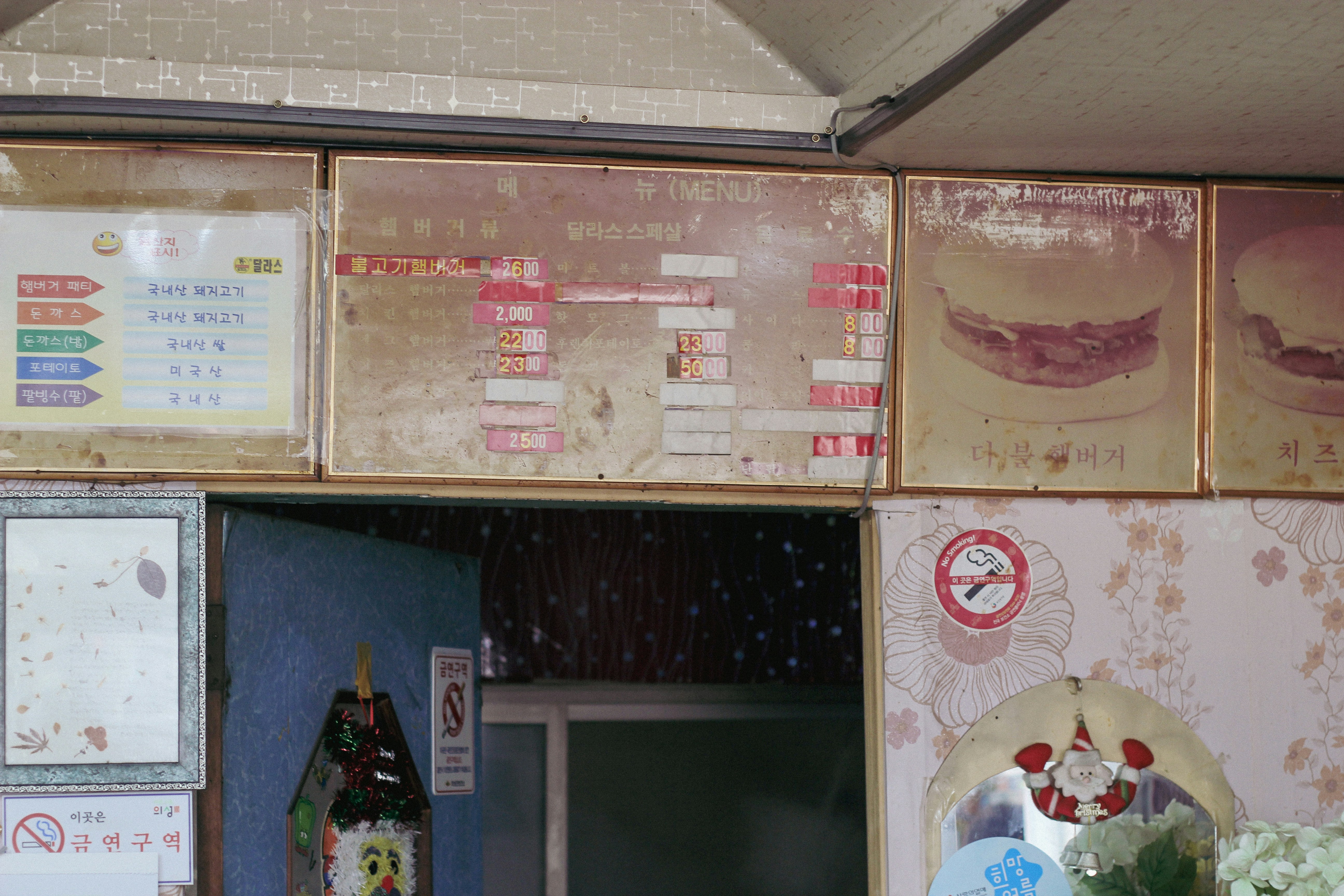 Abandoned Menu Board Over a Deli Counter