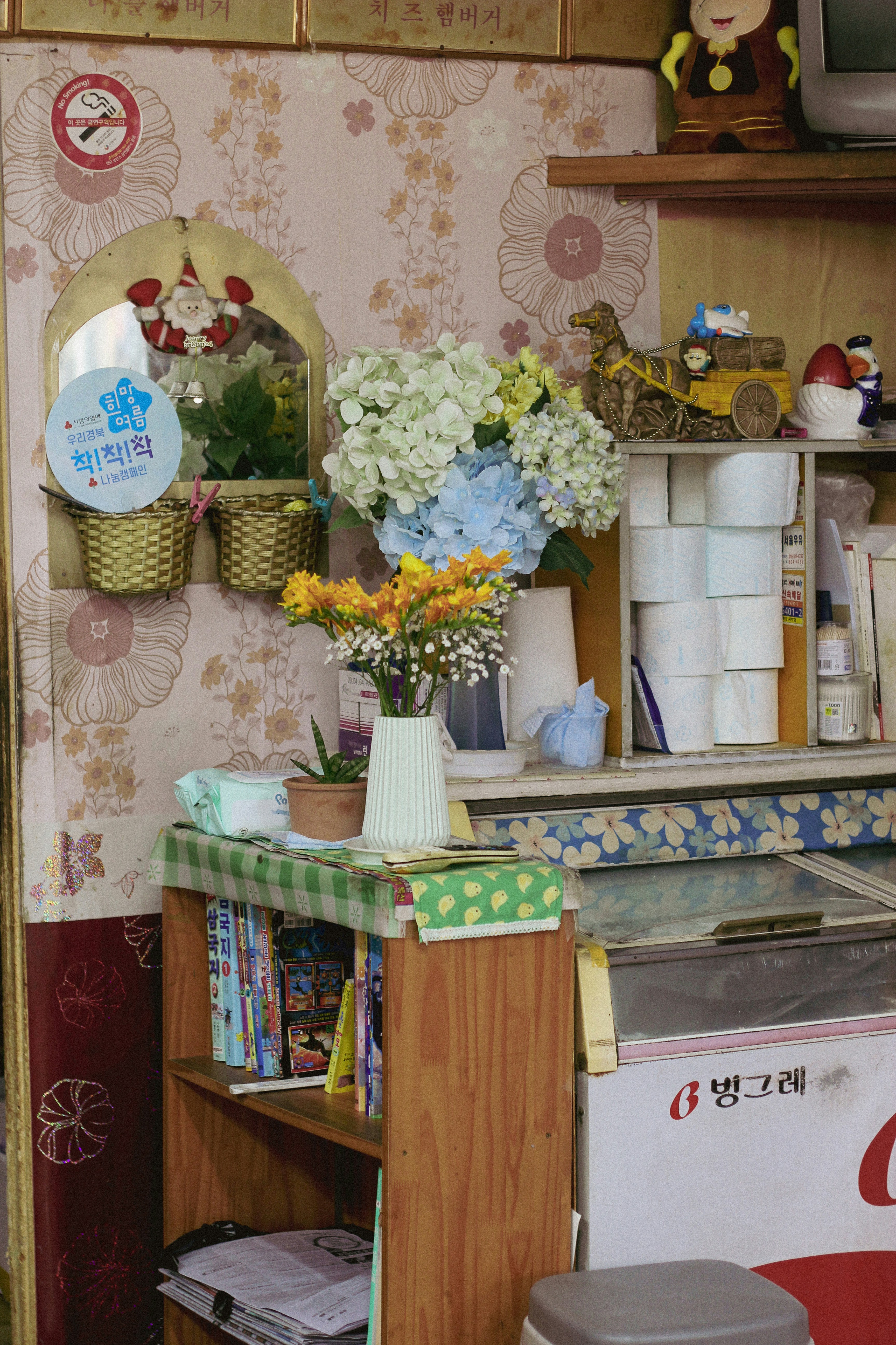 Pastel Display: Hydrangeas and Vintage Shelves in a Cozy Corner