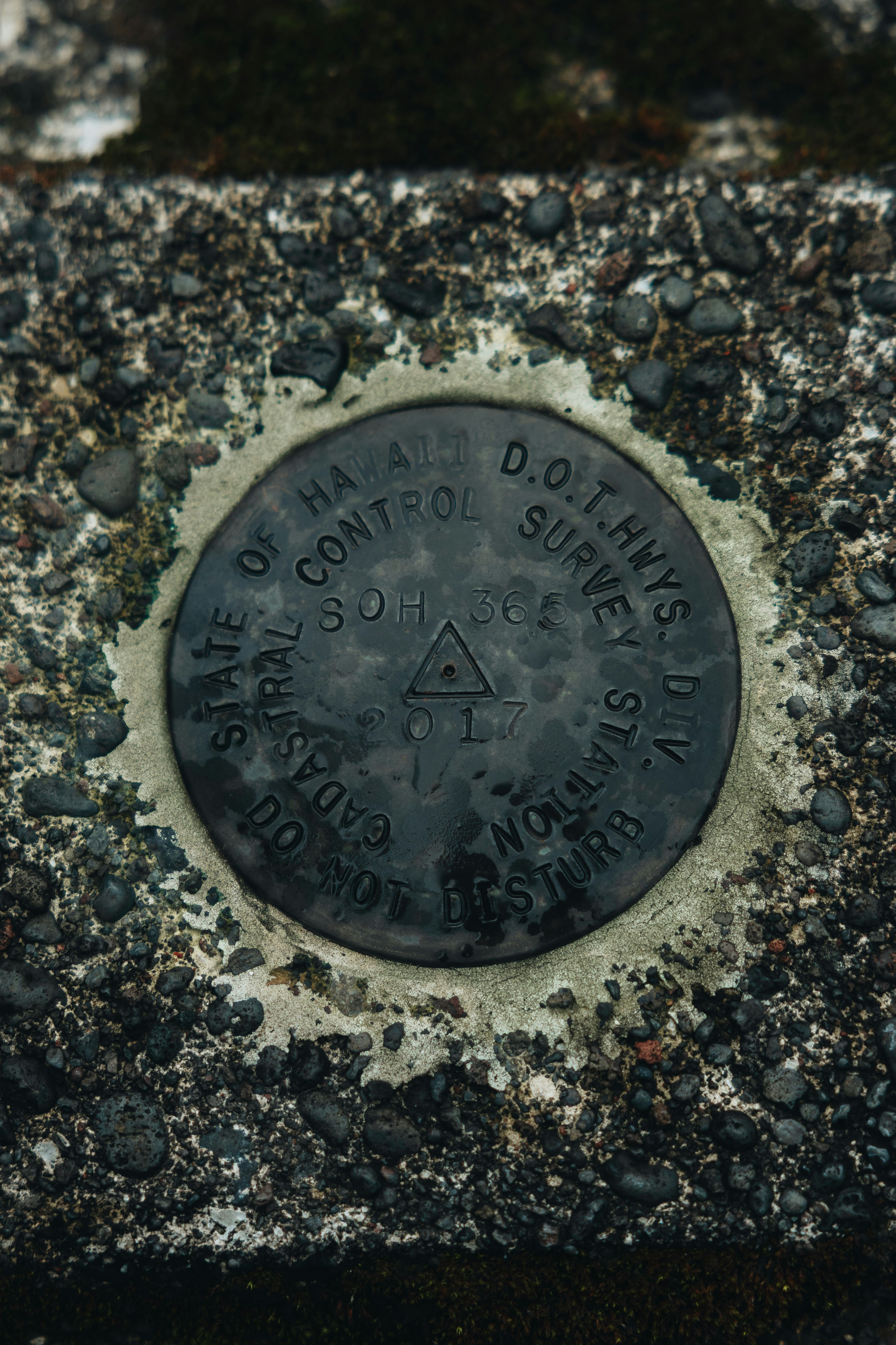 Sealed in Stone: A Weathered Utility Cap in Textured Concrete