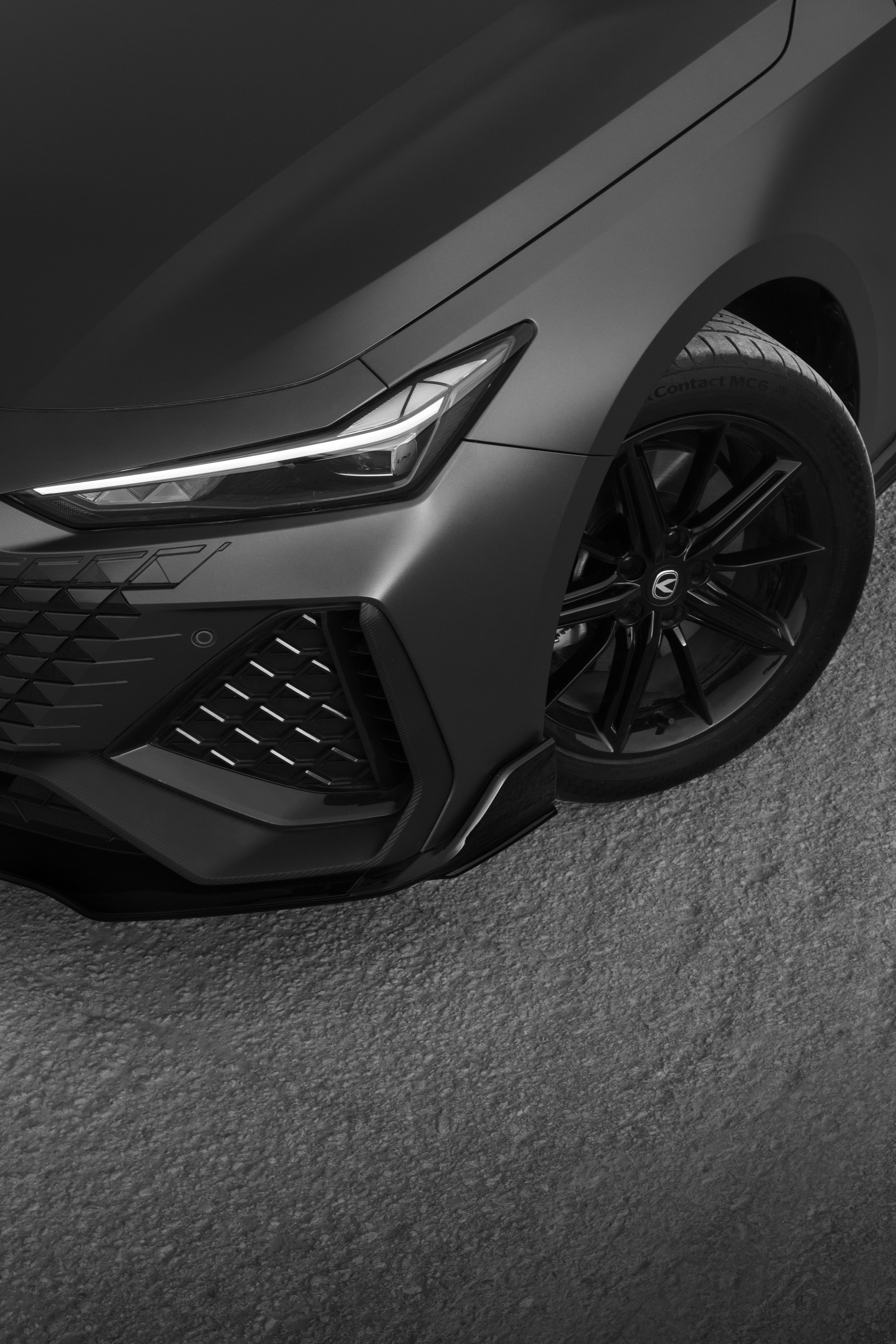 Aggressive Precision: Front-Quarter of a Dynamic Mazda (or similar) Hatchback