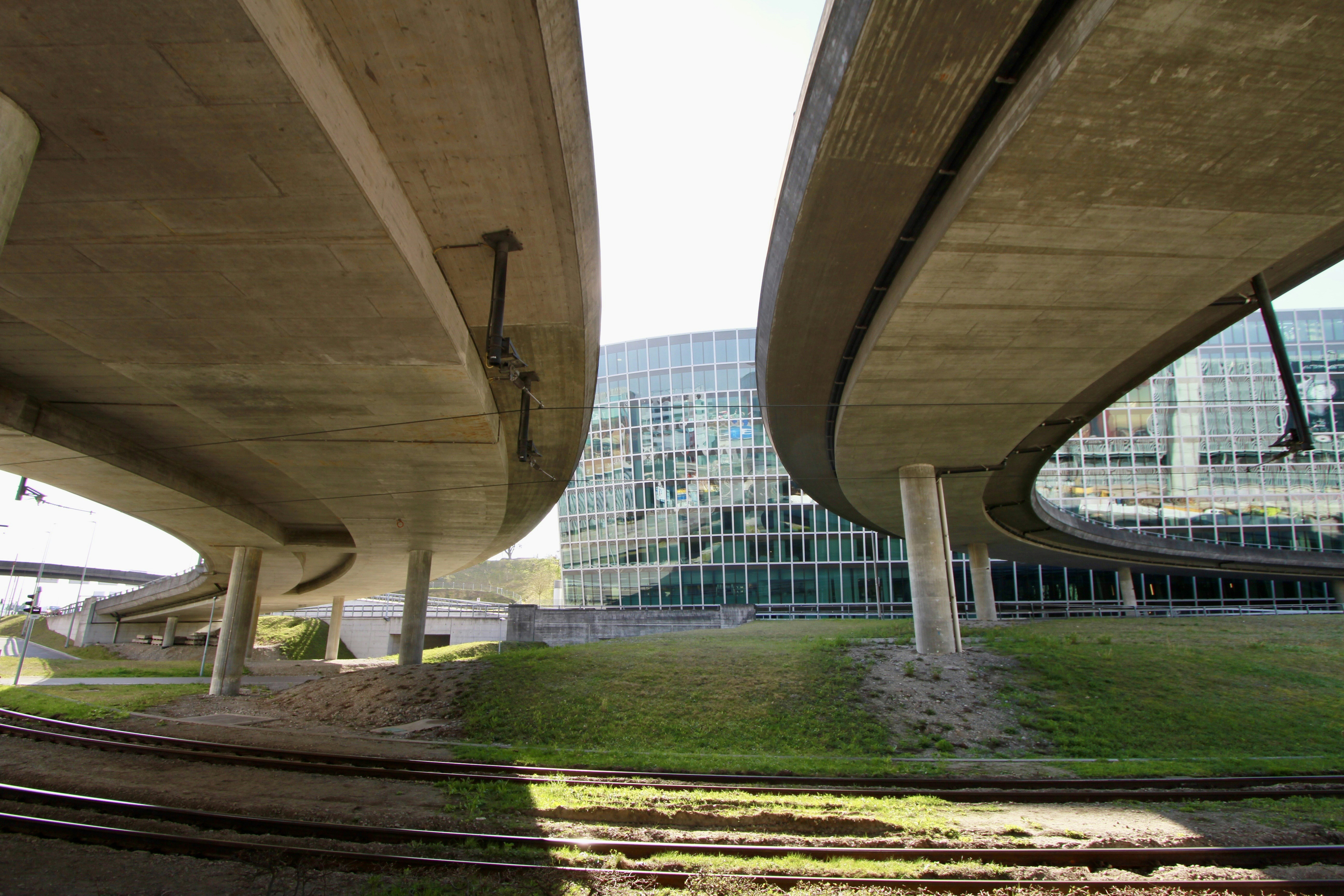 Under the Overpass: A Modern Cityscape Framing the Rails