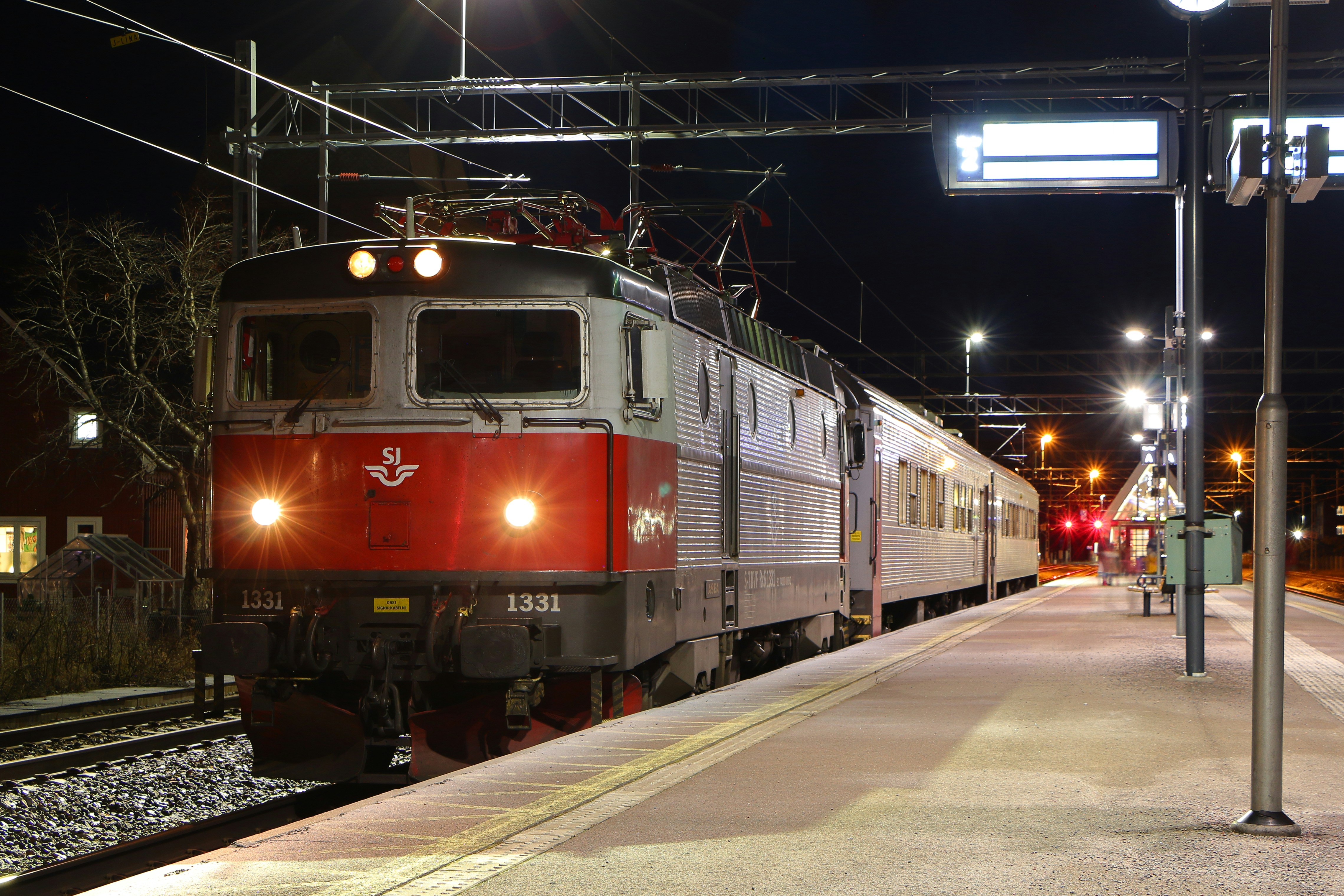 Night Electric: A Freight-Style Engine under Station Lights