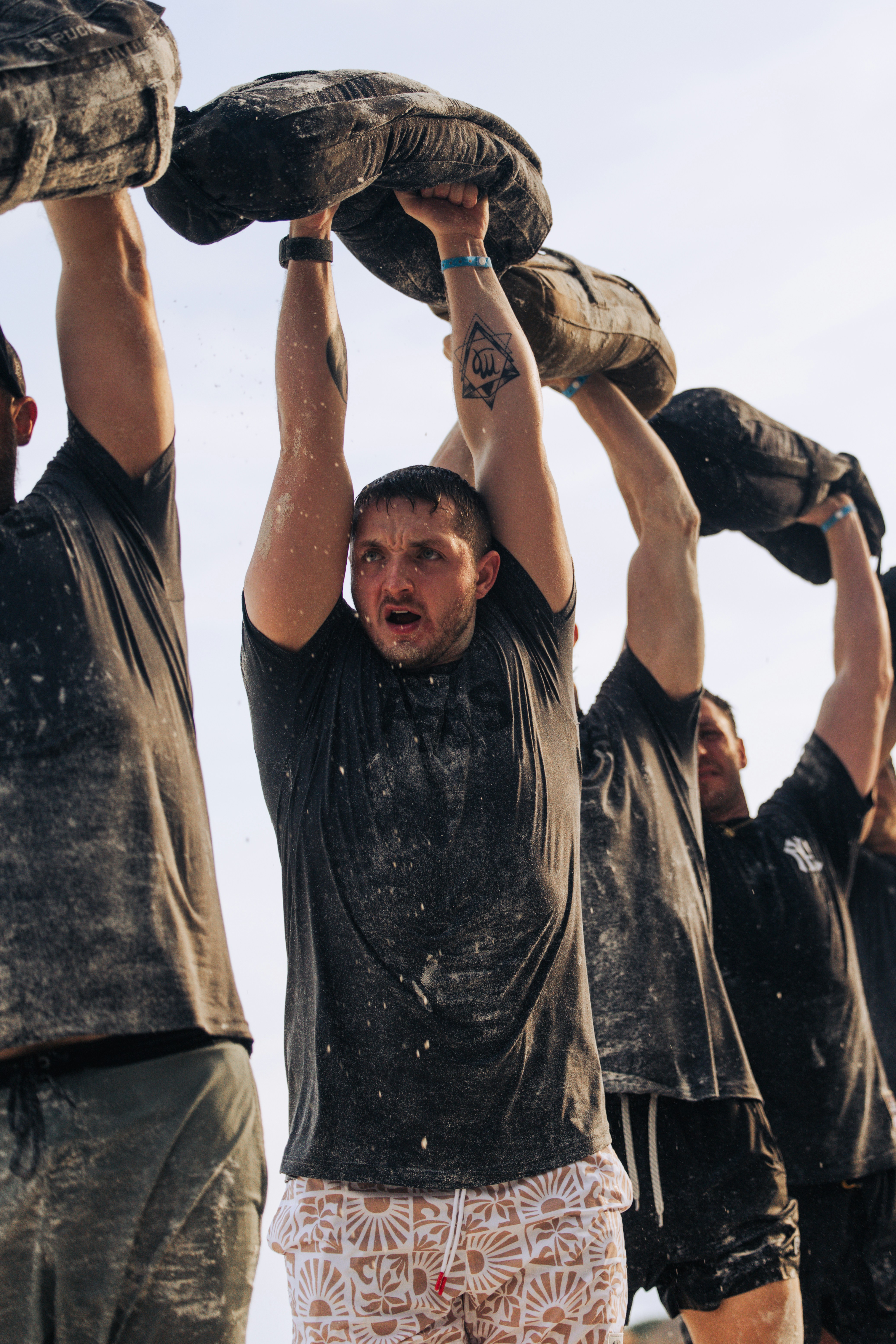 Risers of Strength: Team Lift Under Summer Light