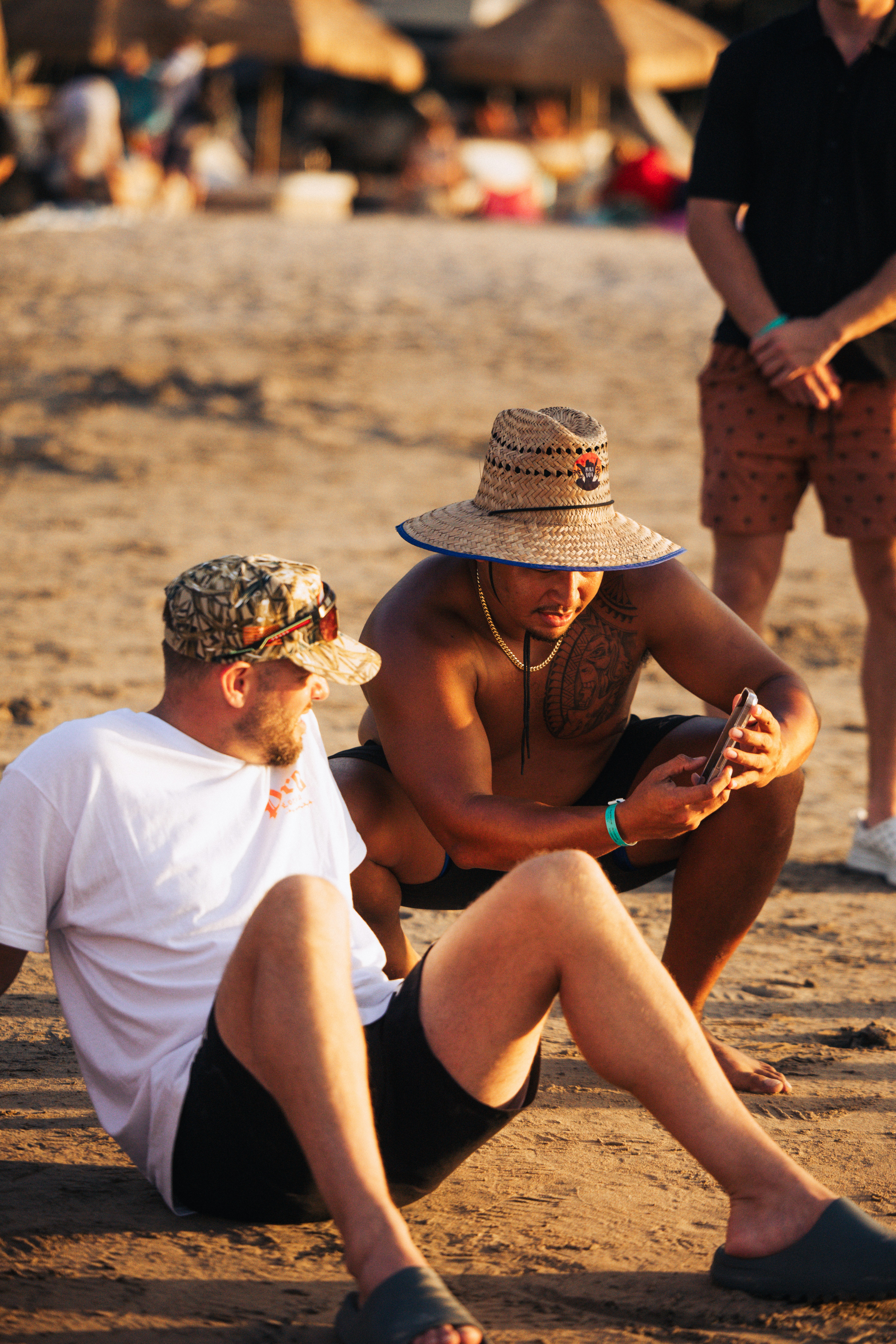 Sunlit Moment: Friends on the Beach at Golden Hour