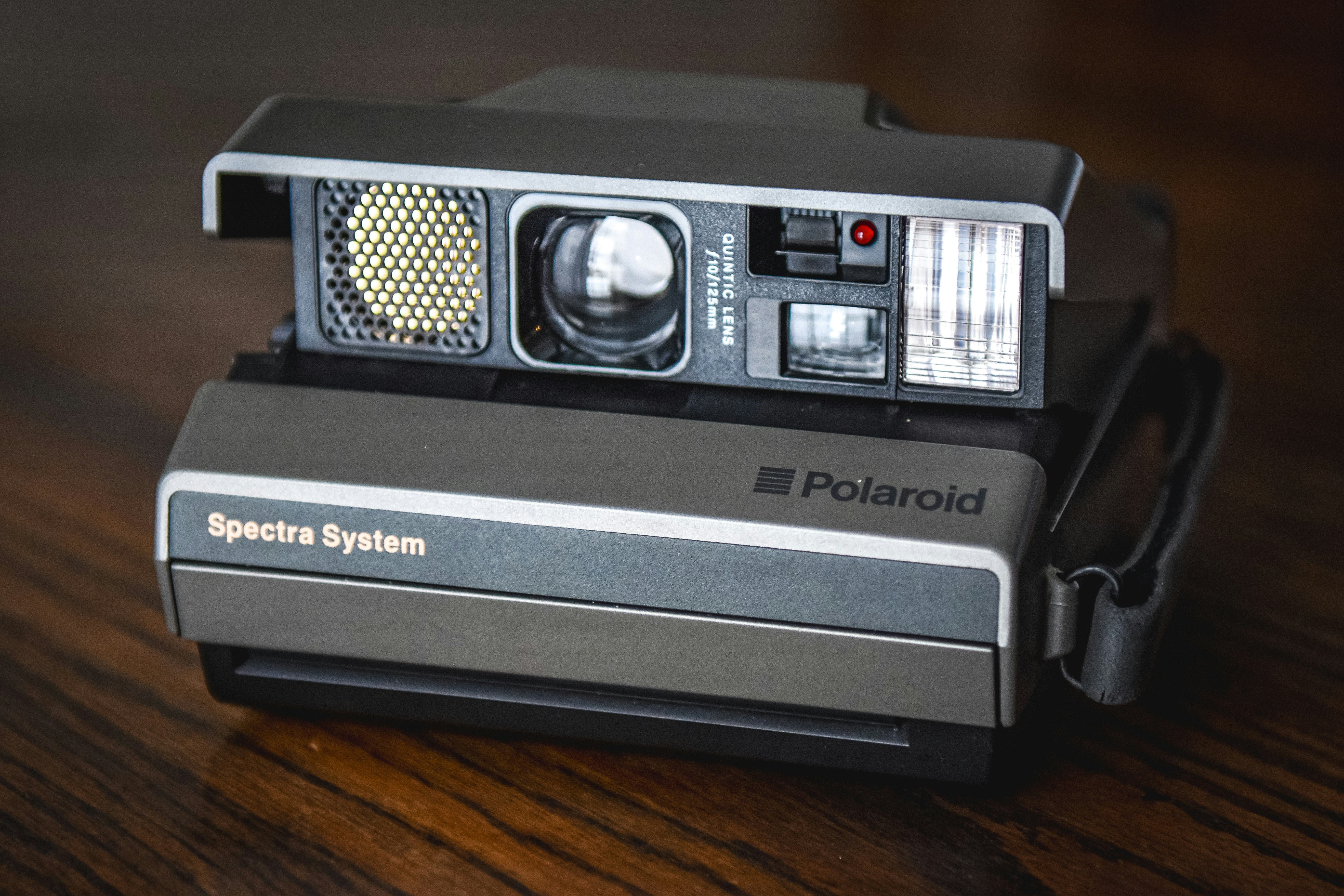 Polaroid Spectra System: A Retro Instant Classic Resting on Wood