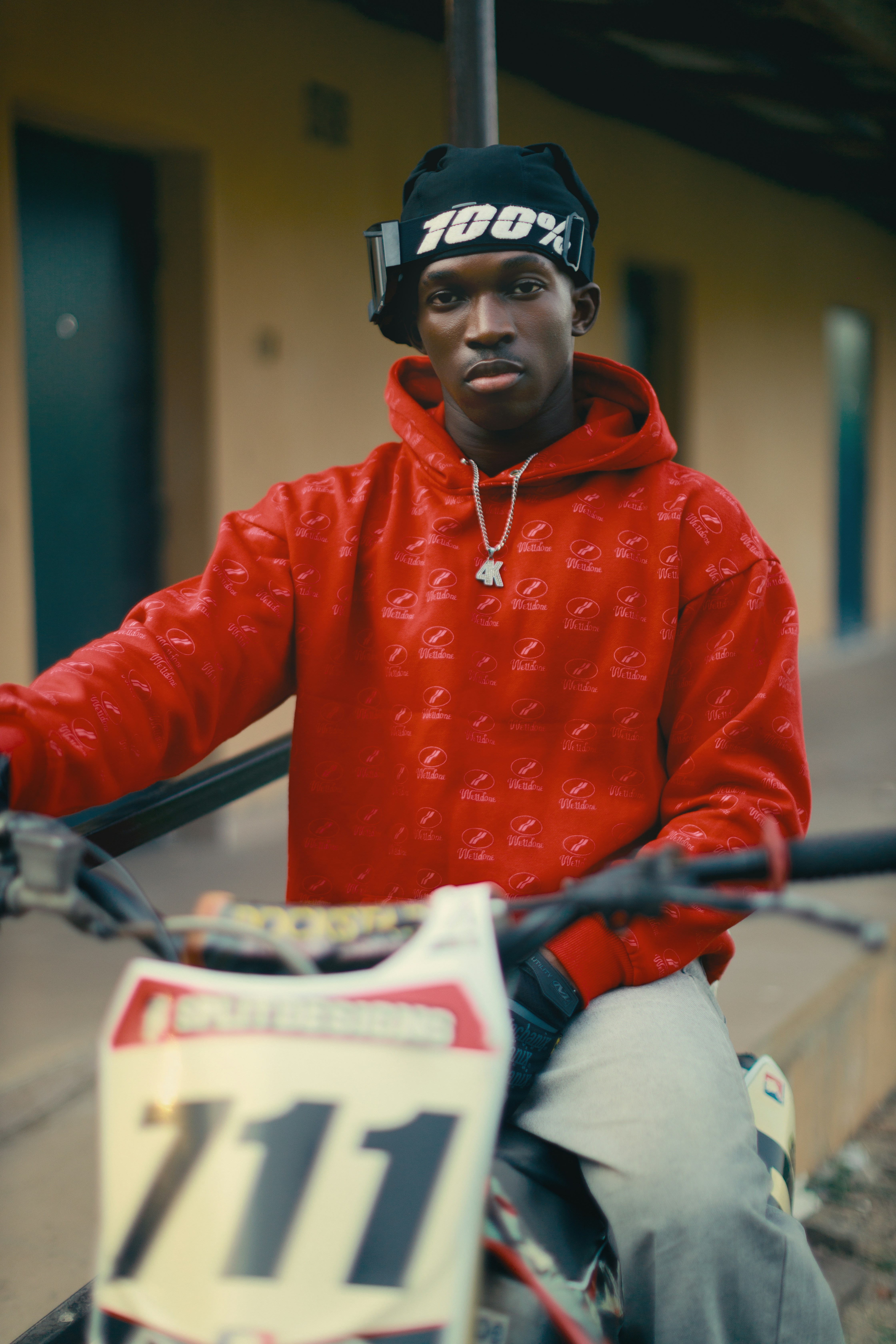 Red Hoodie Rider on a Bike: Focused Grit in Urban Silence