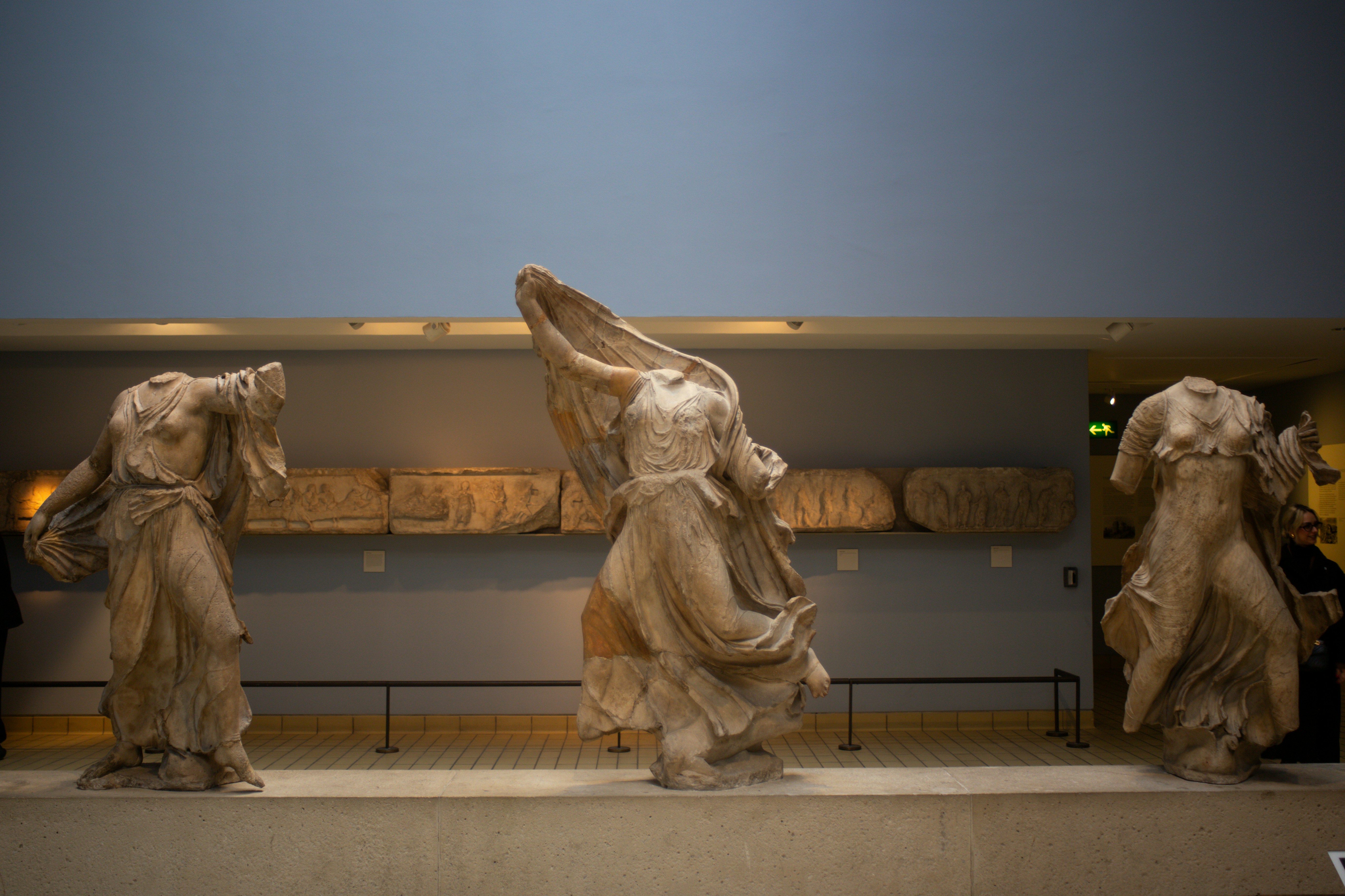 Mid-Creaked in Stone: Triptych of Ancient Statues on Display