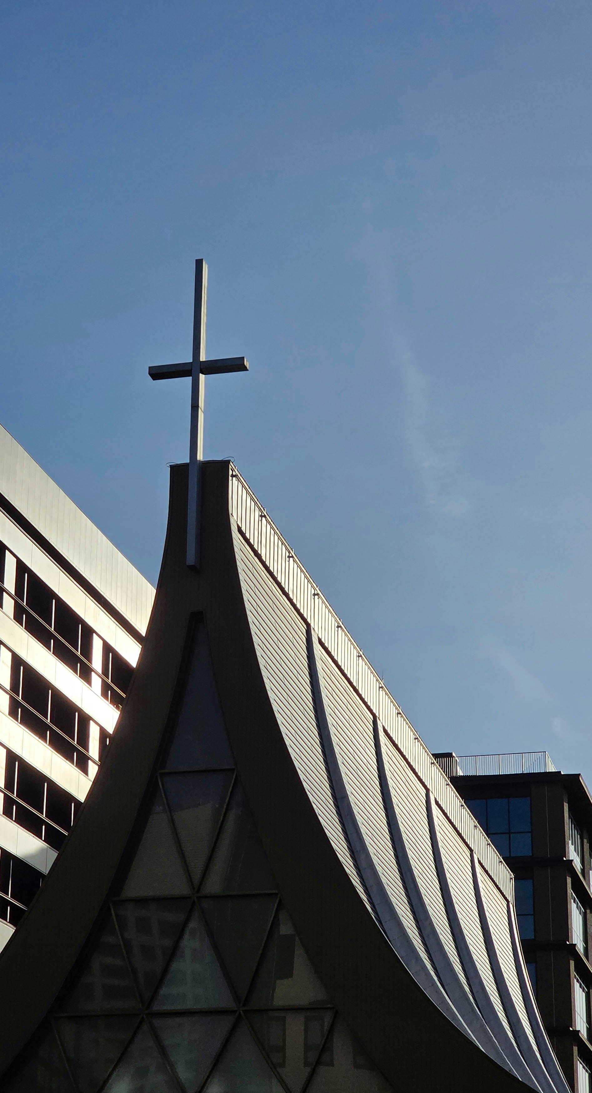 Cross on the Arch: A Modern Cathedral Reaches Toward the Sky