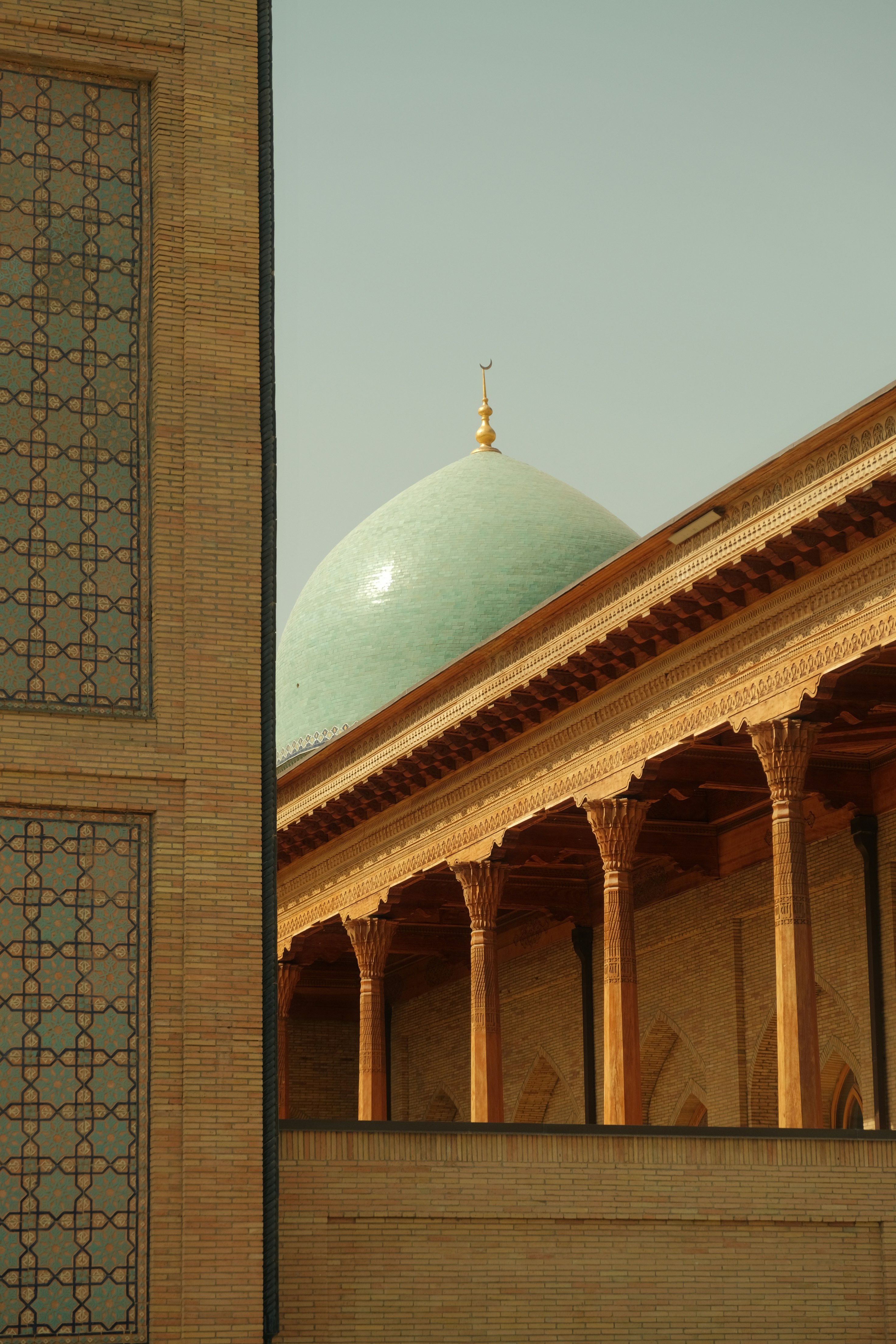 Green Dome between Brick Walls: A Quiet Corridor of Light