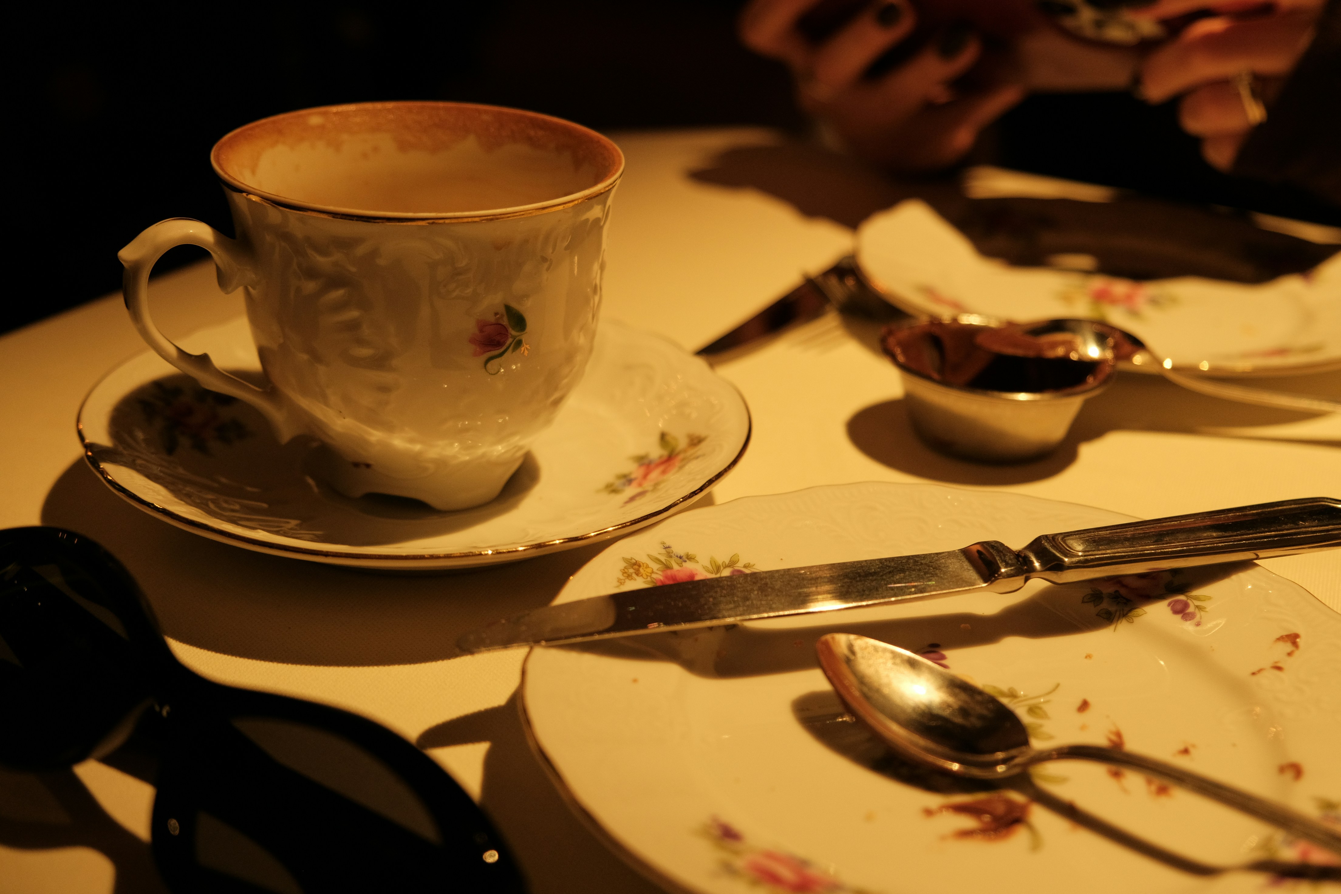 Late-afternoon Tea: Steam and Shadow on a Floral Table
