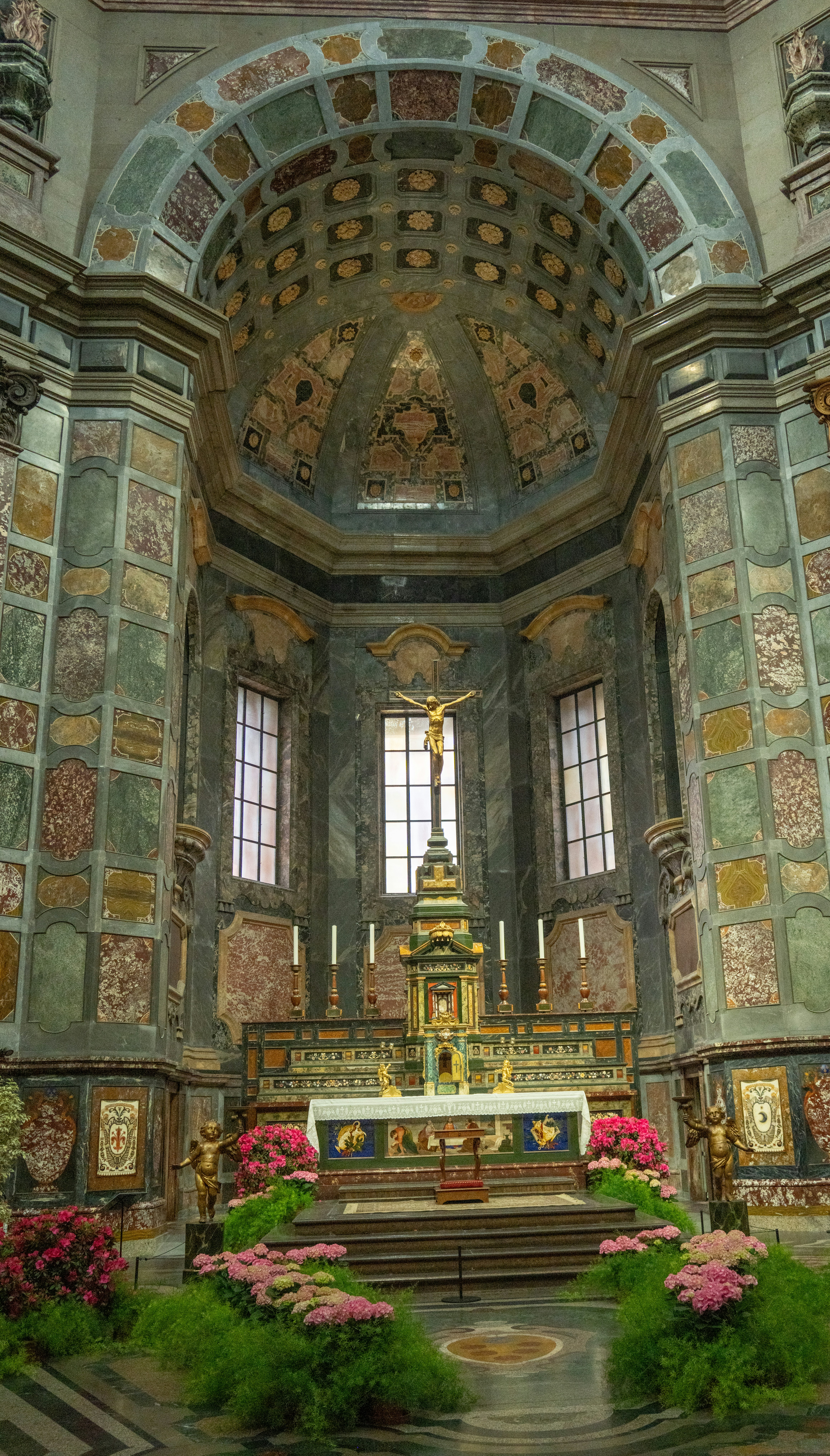 Sanctuary of Light: Altar and Crucifix Framed by Marble Within a Tessellated Dome