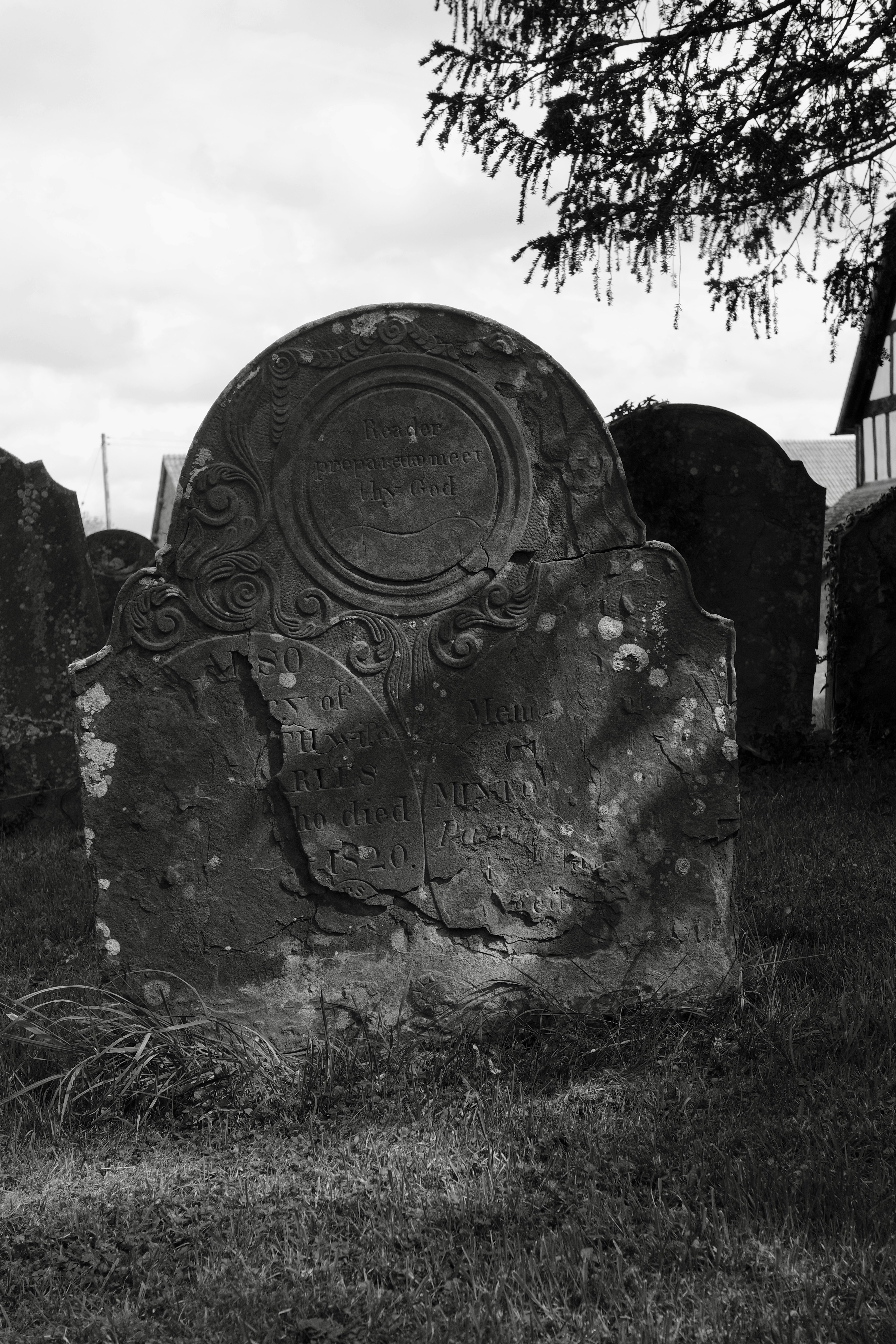 Weathered Stone: A Grave Marker in Monochrome Silence