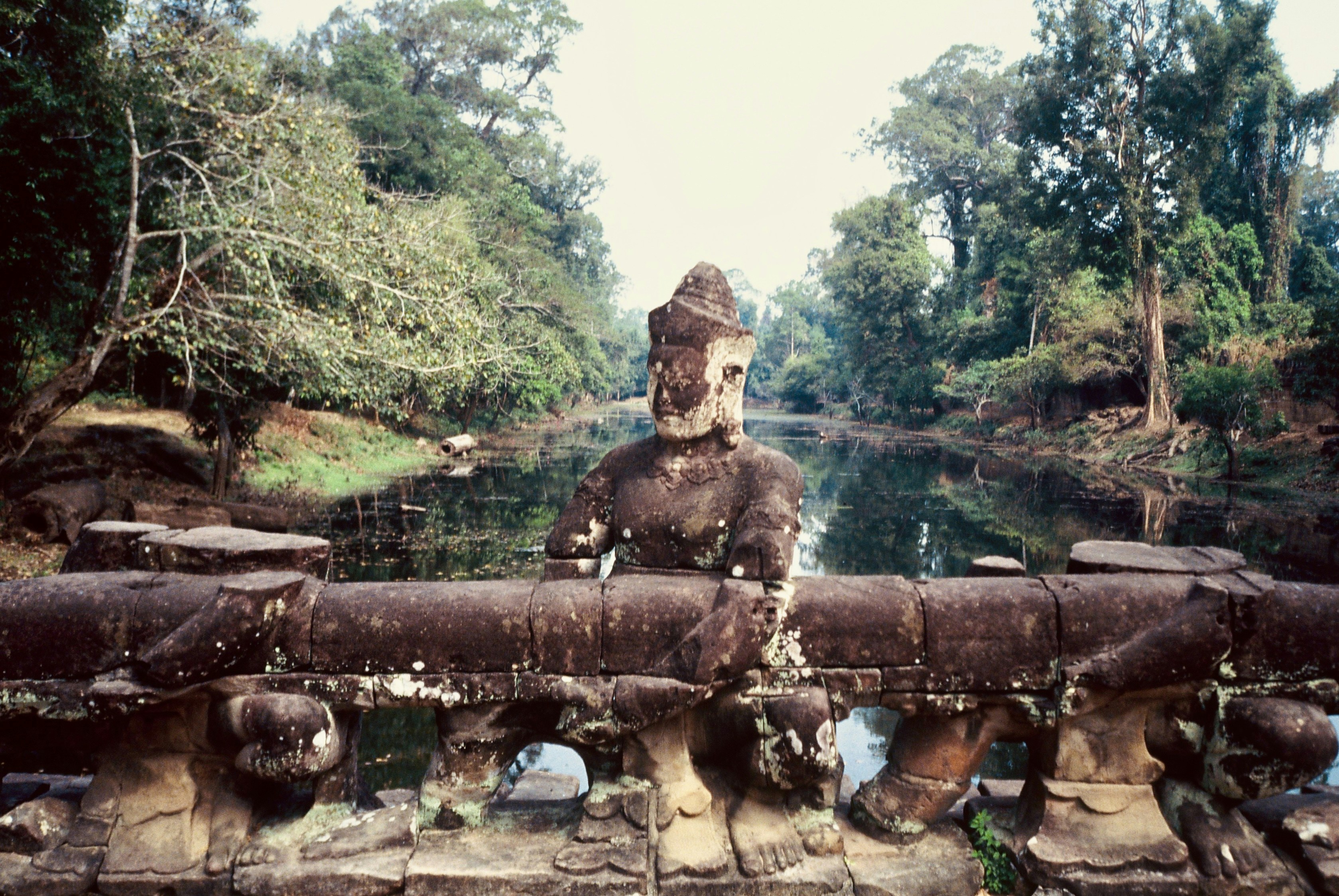 Stone Guardian over a Quiet Canal