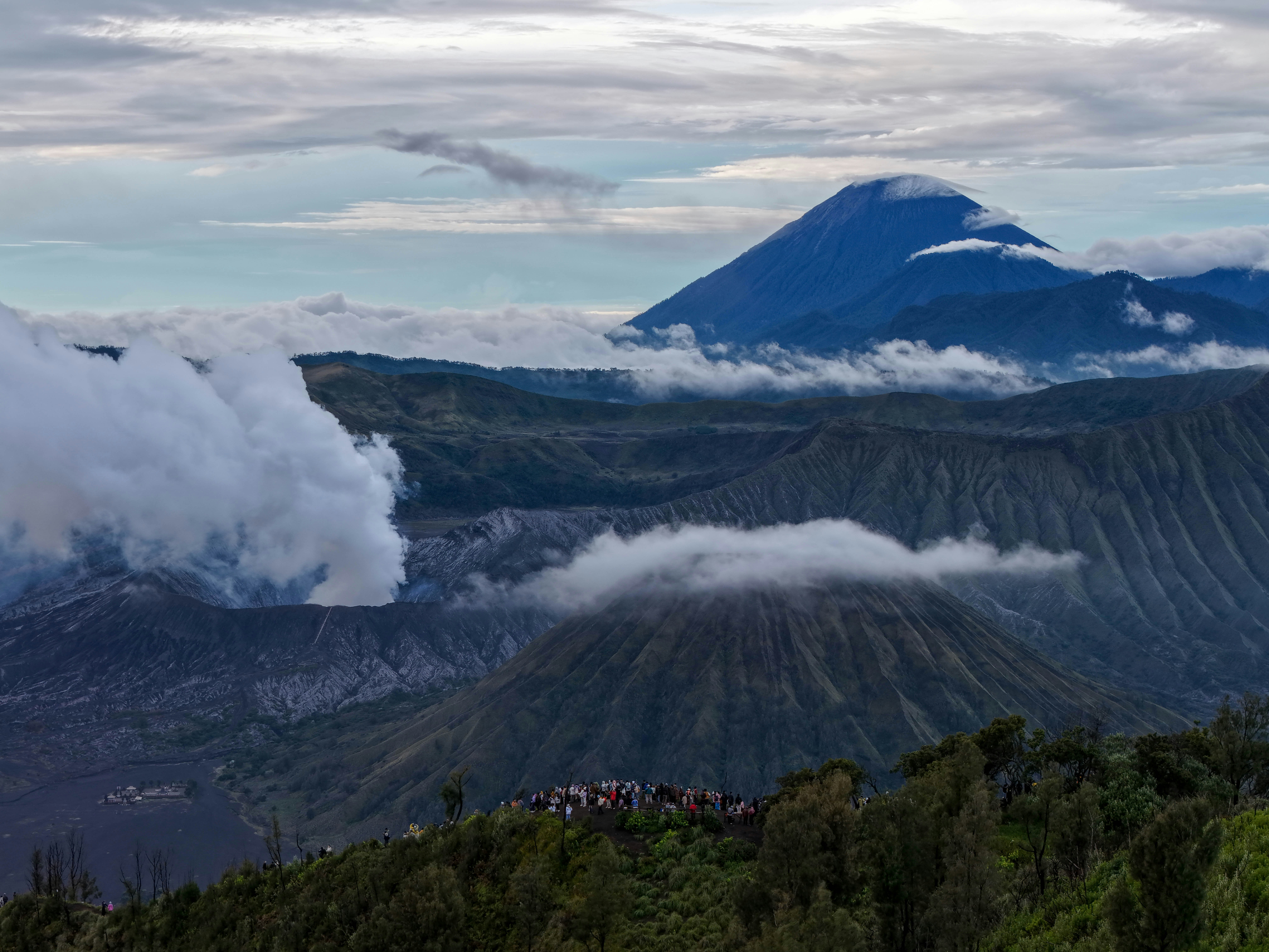 Ridge-Line Reverie: A Volcanic Panorama Beneath Cloud-Kissed Peaks