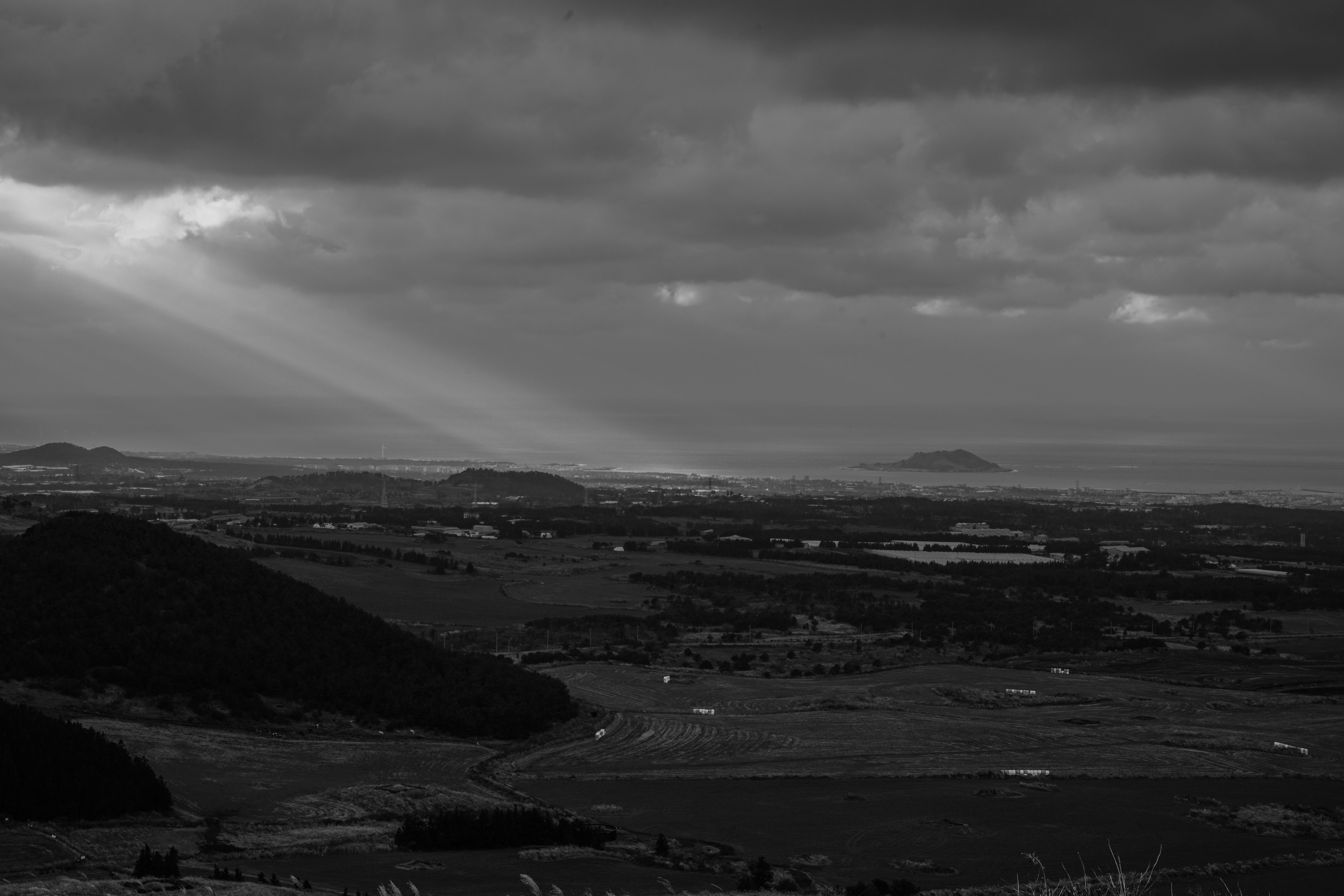 Rays Through the Distant Clouds Over a Quiet Valley
