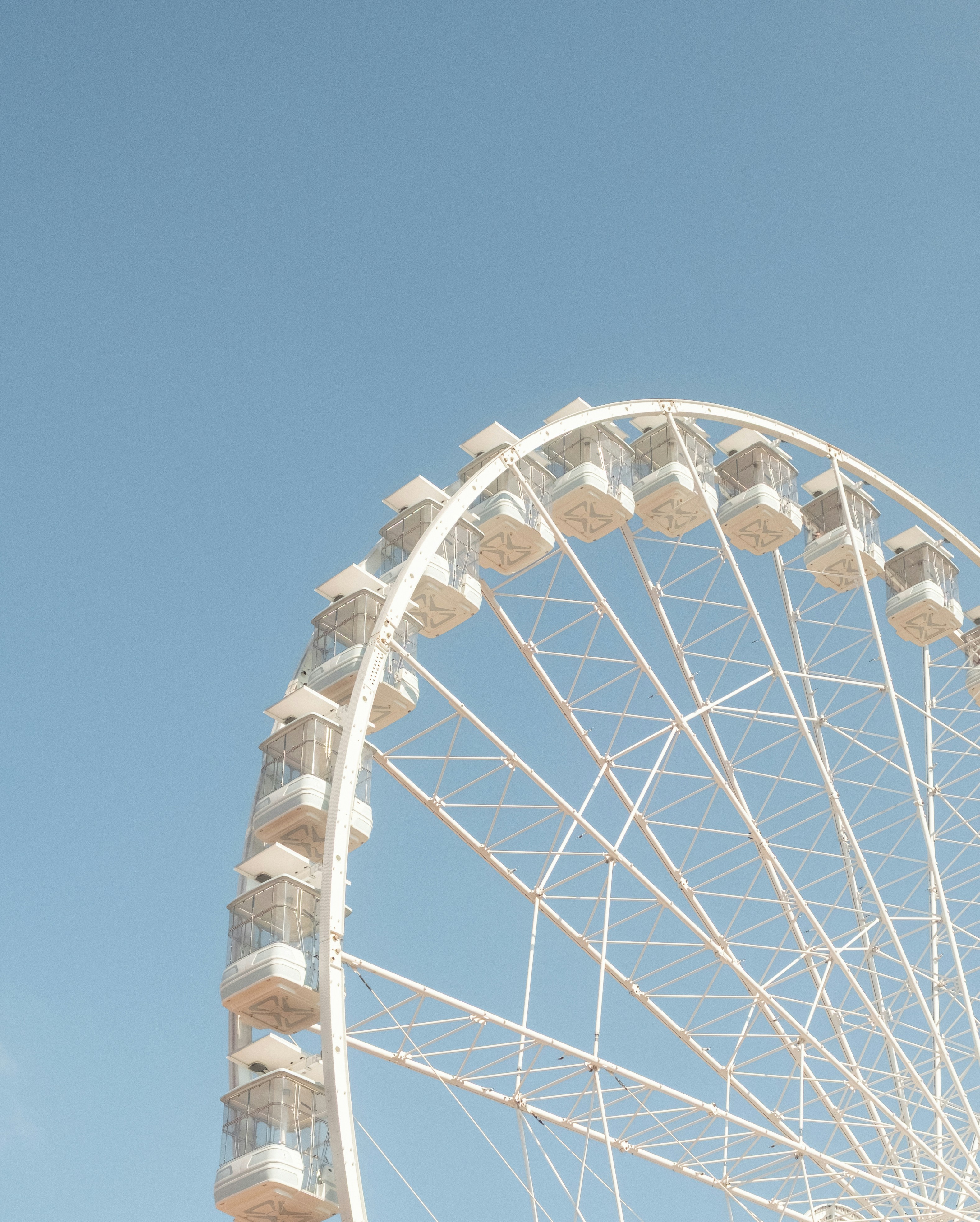 Skyward Wheel: A Ferris Circle Reaching Toward the Blue