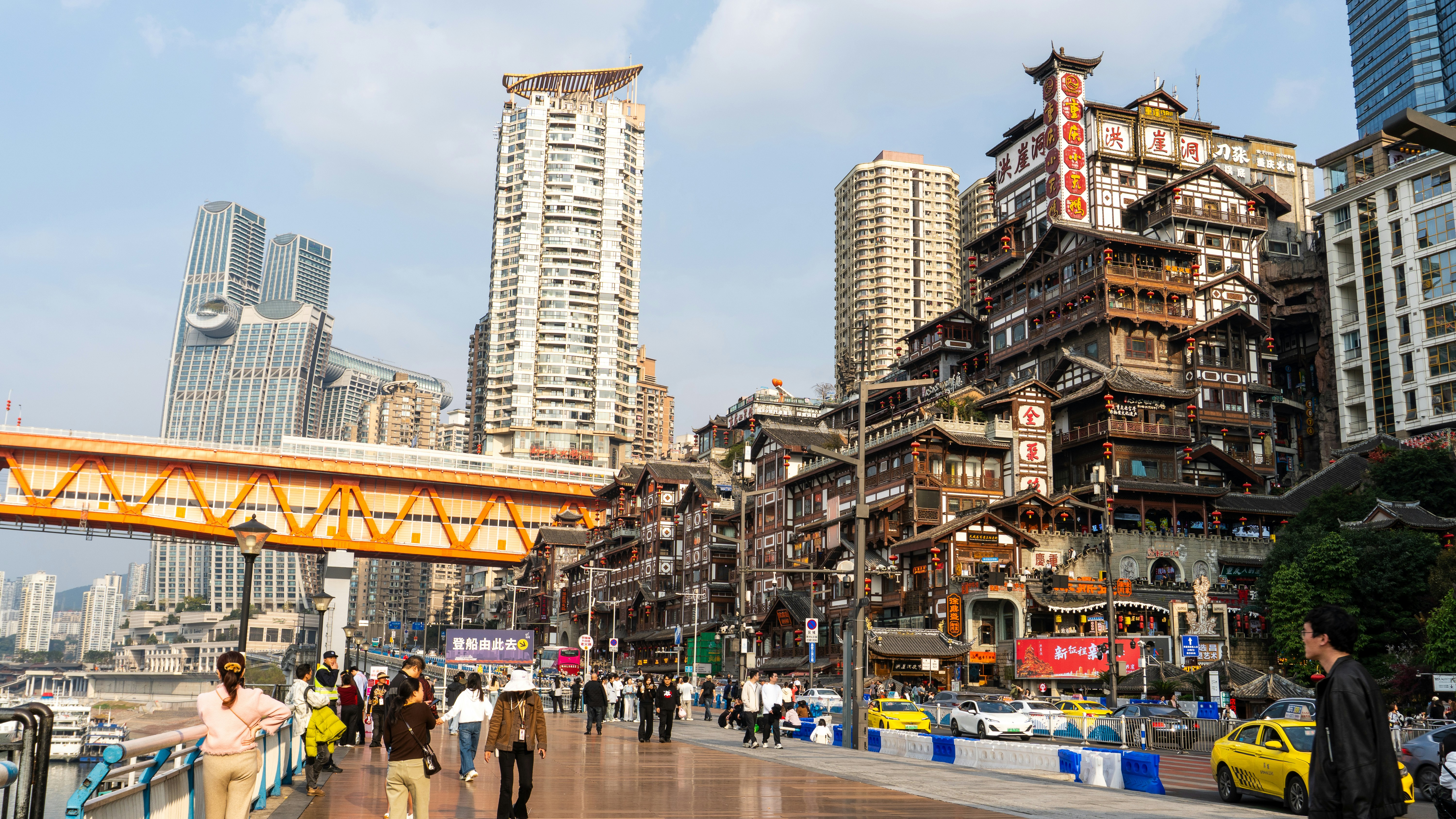 Riverside Alley: Neon Facades and Busy Pedestrian Corridor