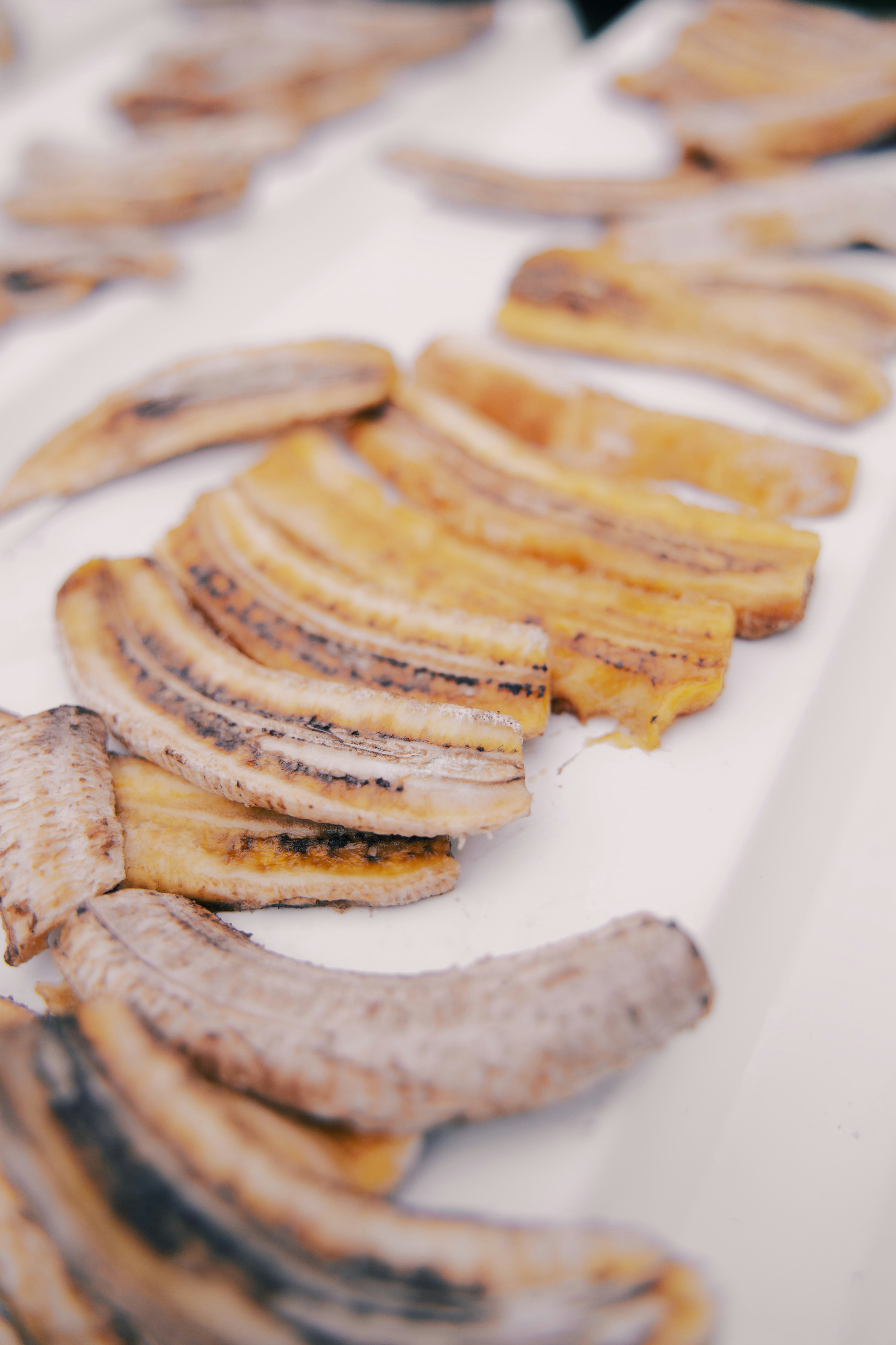 Curved Banana Chips Parade on a White Tray